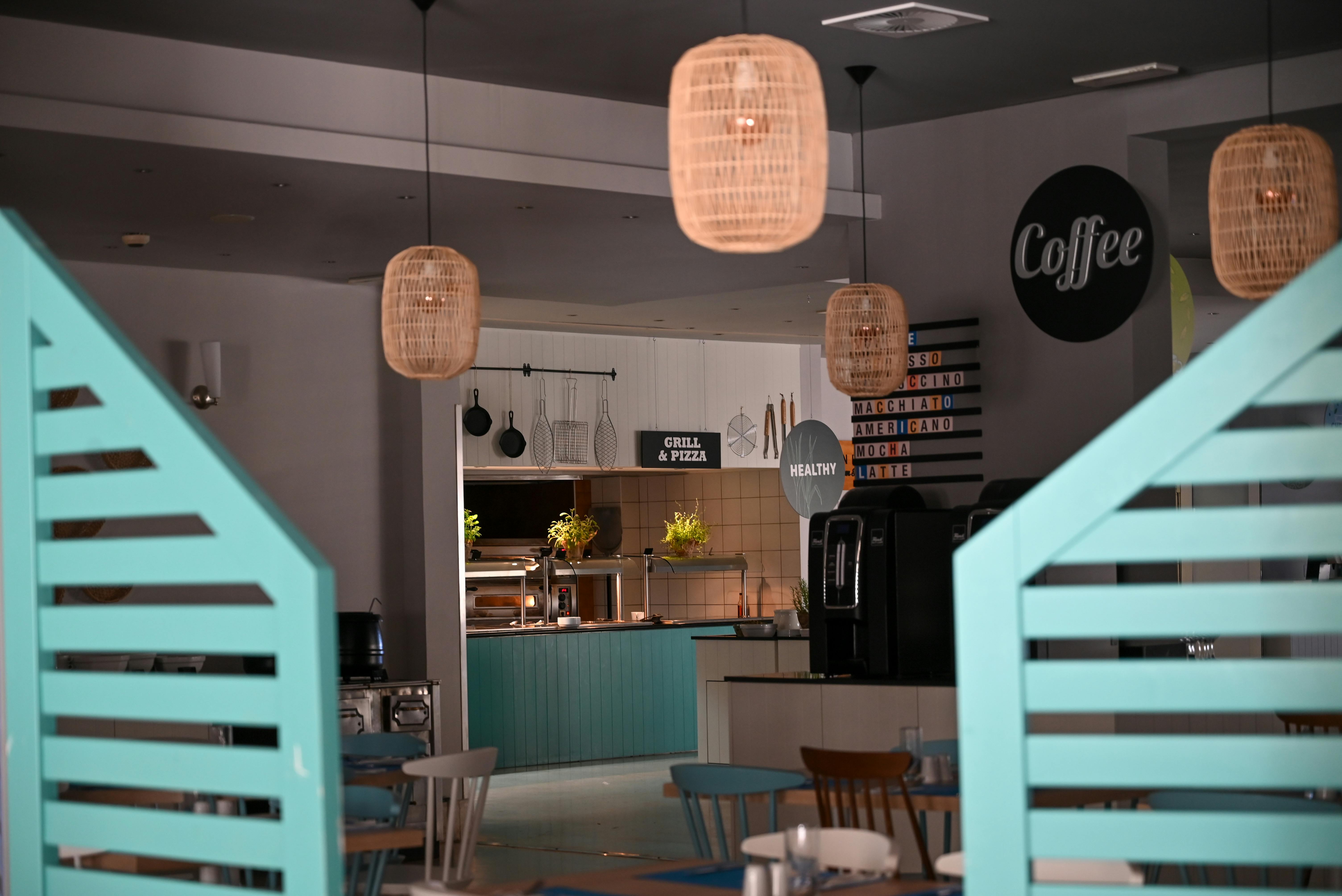 Cafe Interior behind Wooden Doors · Free Stock Photo