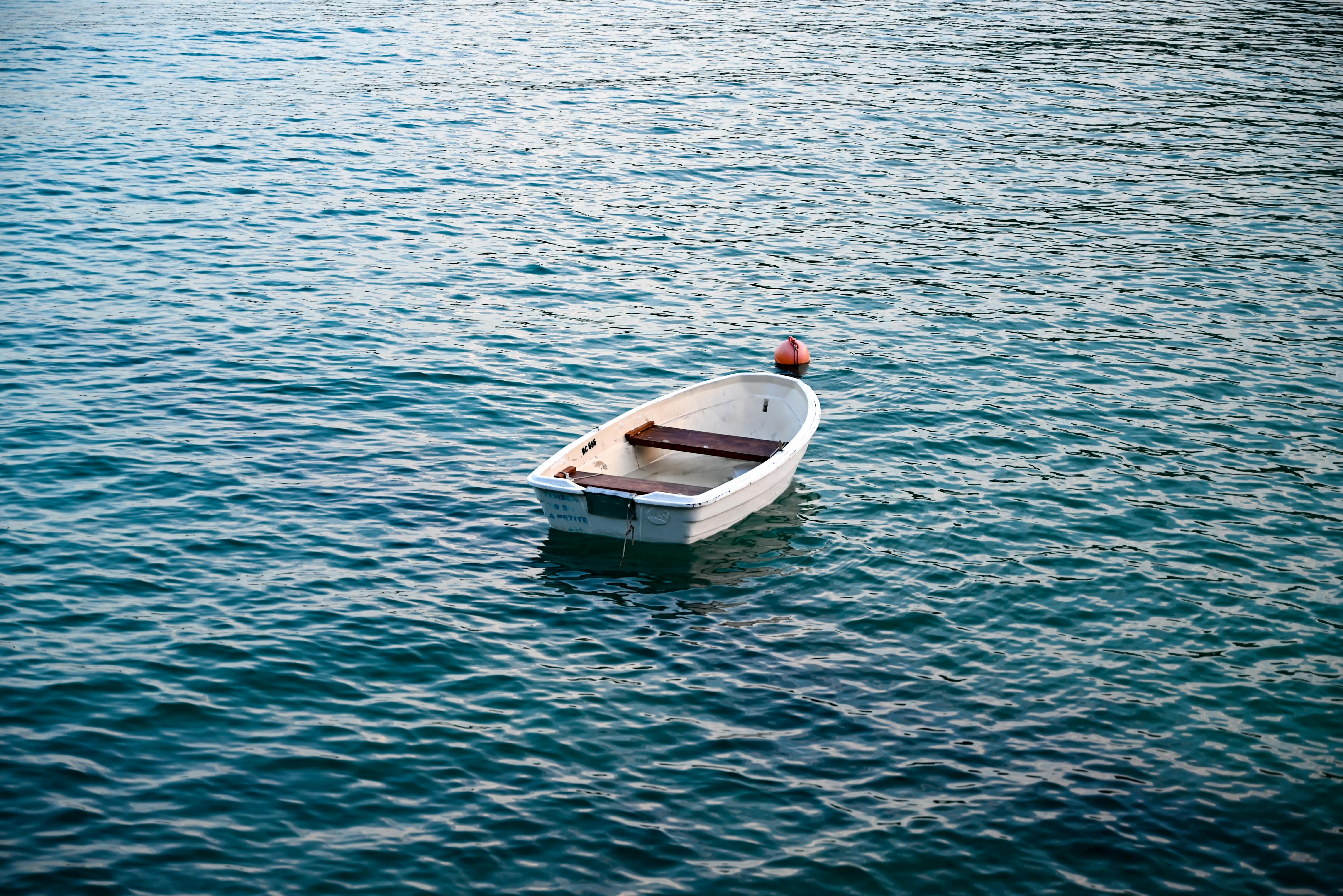 Empty Motorboat Floating in a Lake · Free Stock Photo