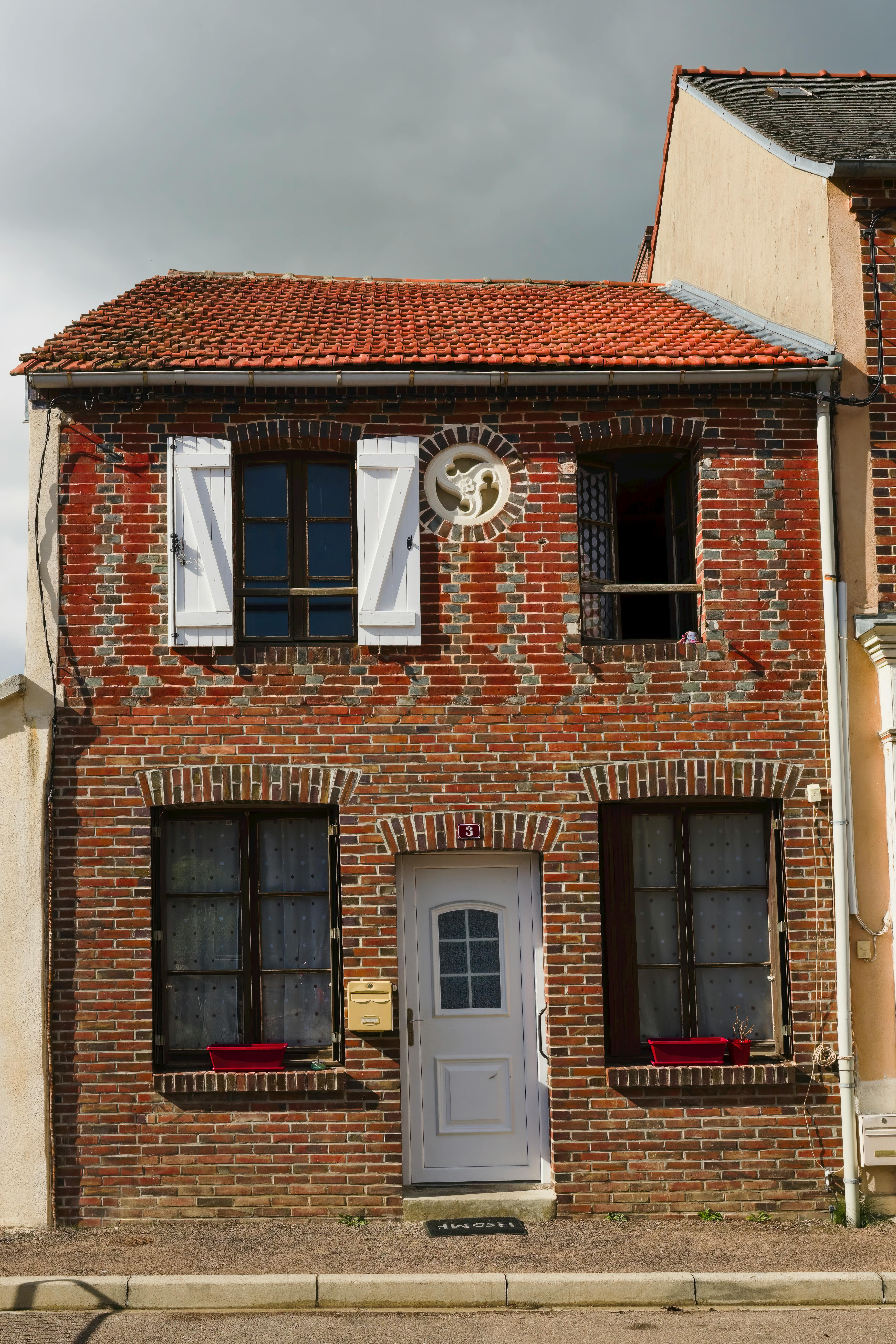 Facade of a Traditional Red Brick Building · Free Stock Photo