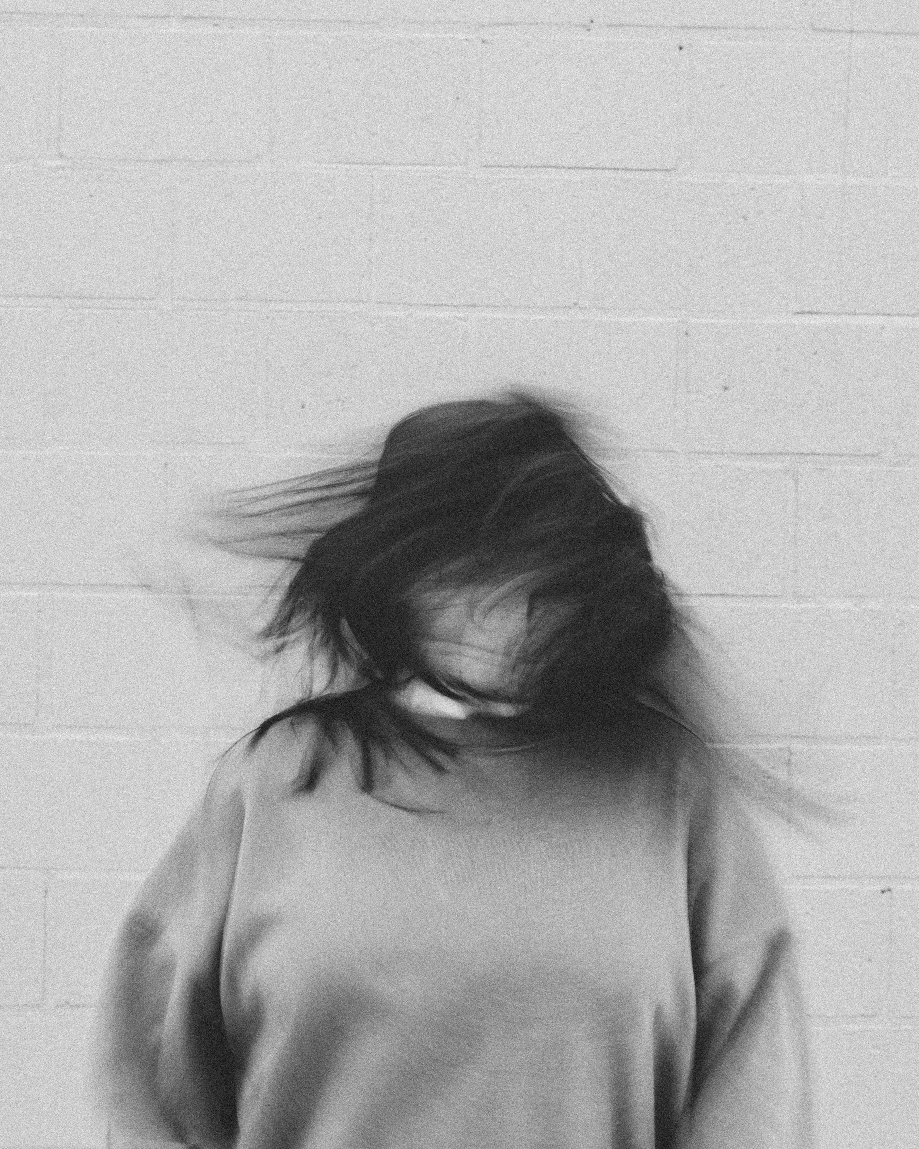 Portrait of Woman with Blurred Hair · Free Stock Photo