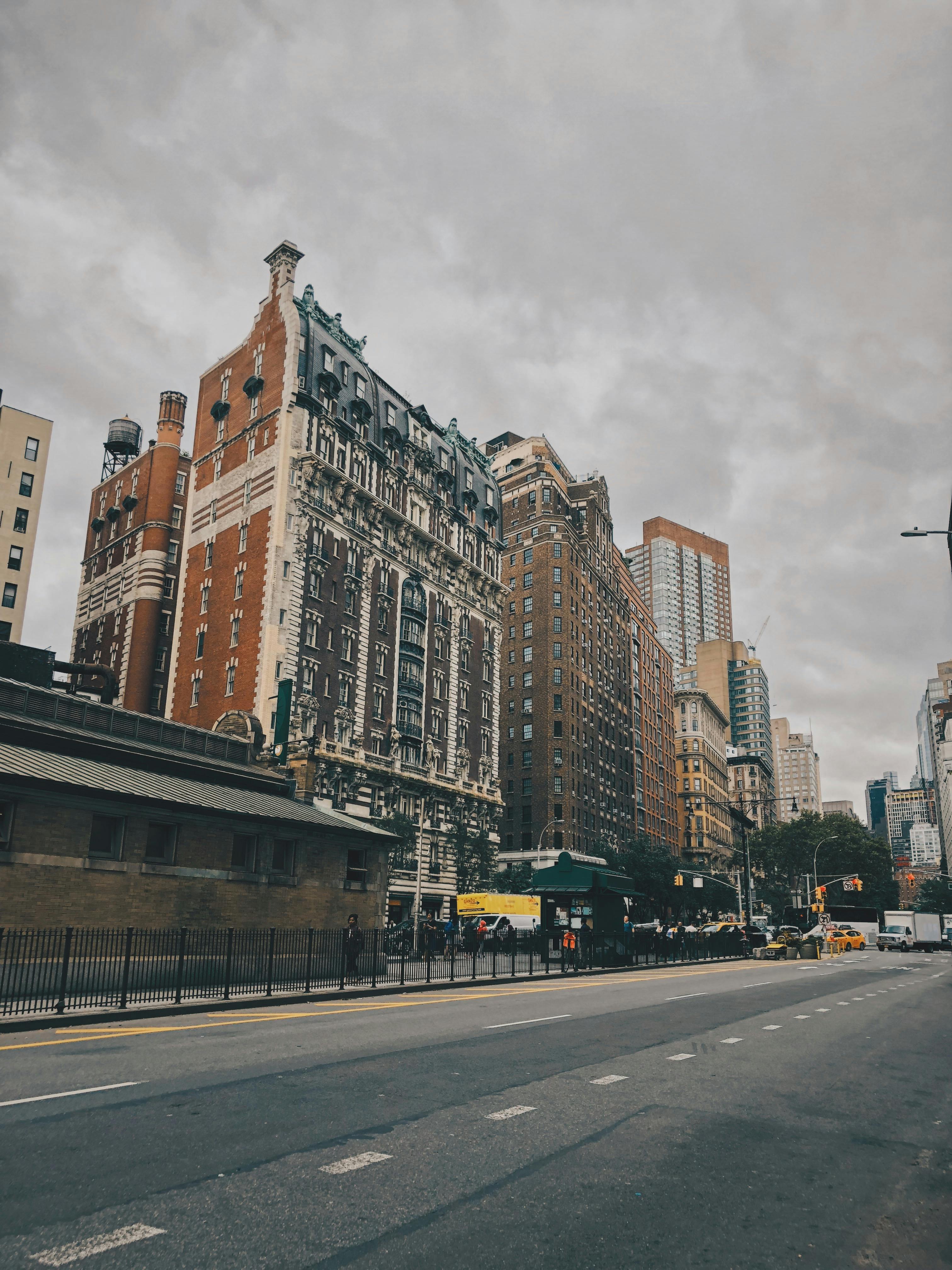 Photo of Tall Buildings Near Road · Free Stock Photo
