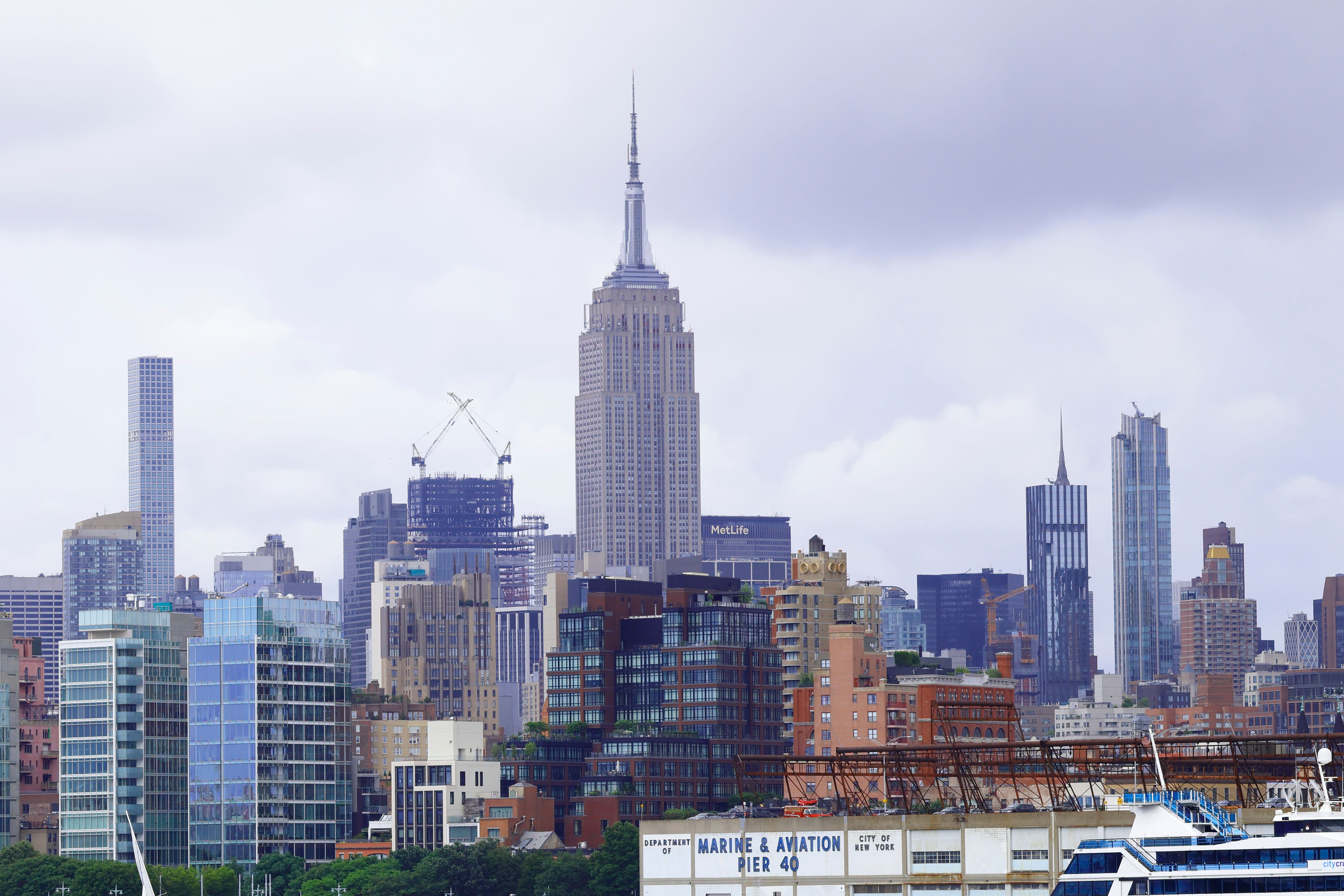 Manhattan Skyscrapers on Coast at Night · Free Stock Photo