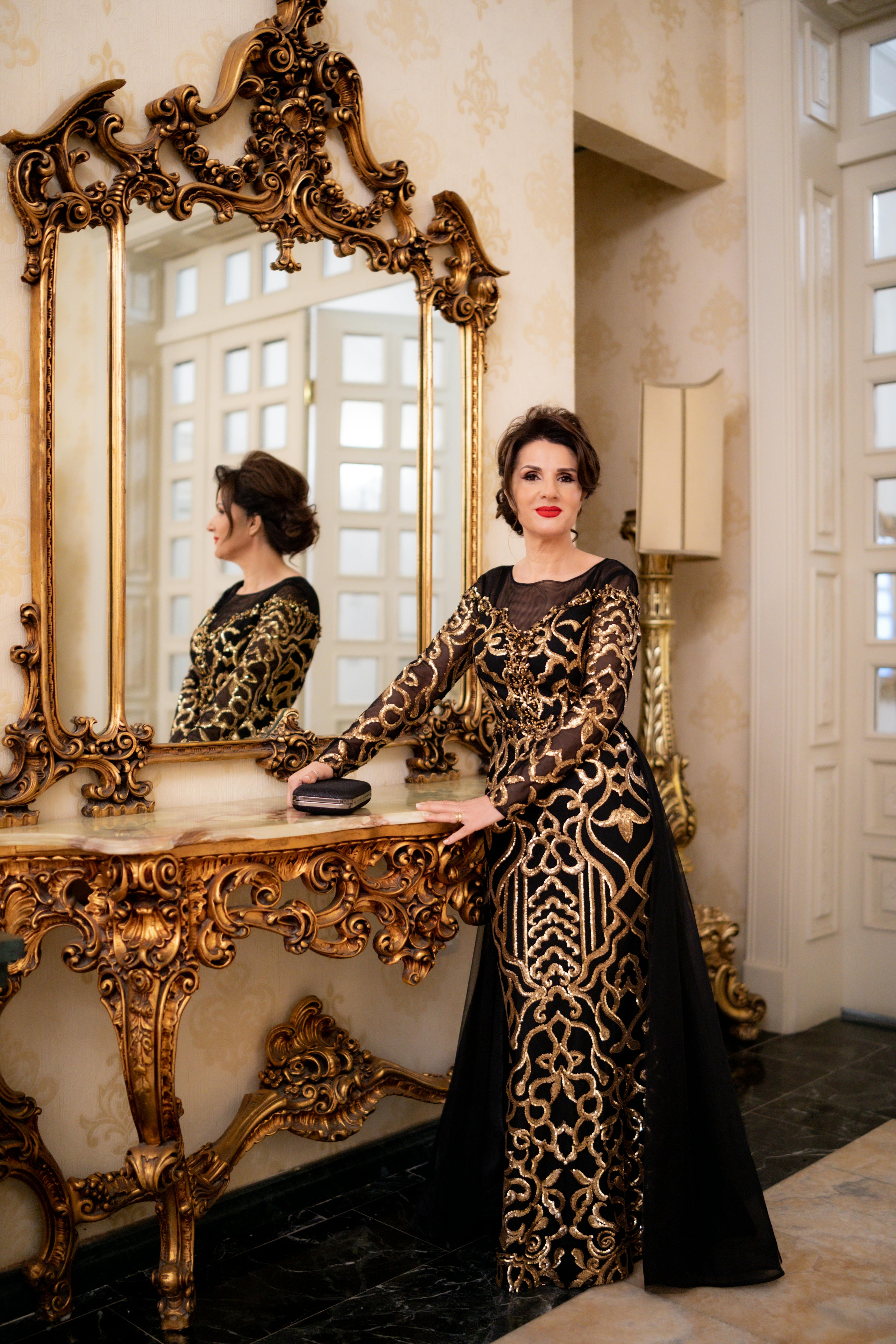 Female Fashion Model Posing in a Red Leather Dress · Free Stock Photo