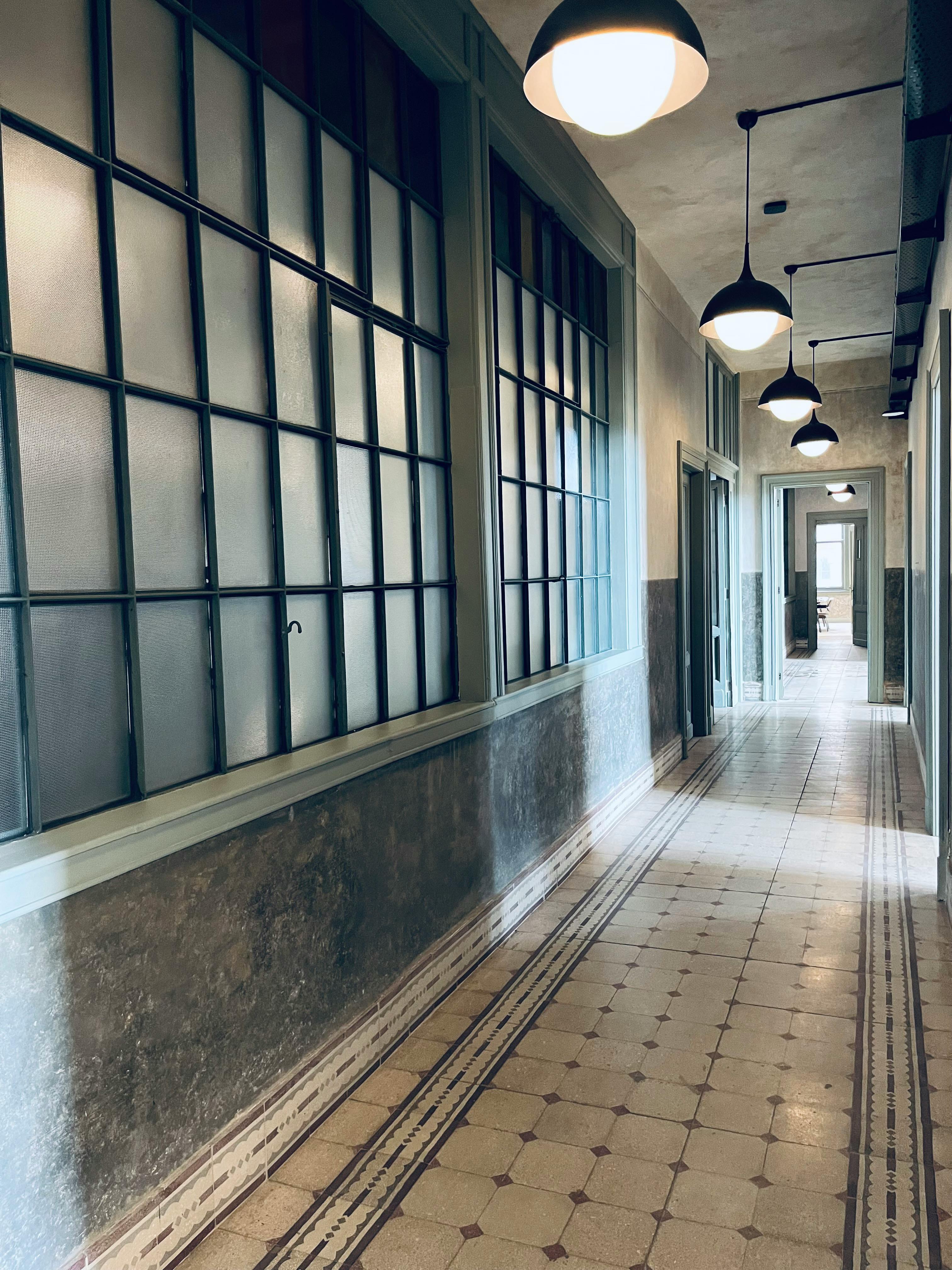 Symmetrical View of a Corridor with an Arched Entrance · Free Stock Photo