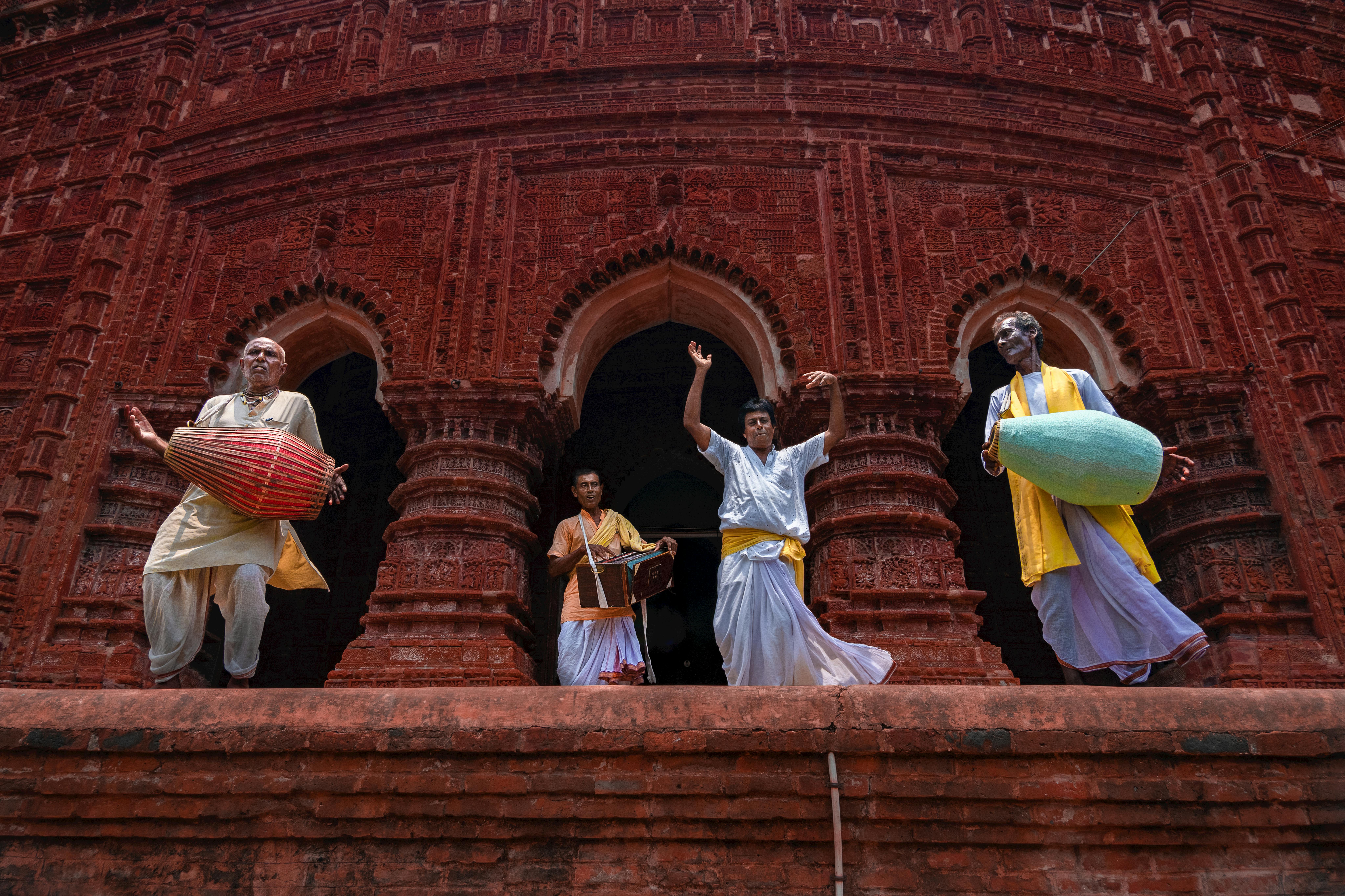 People Dancing and Playing in Front of a Temple · Free Stock Photo