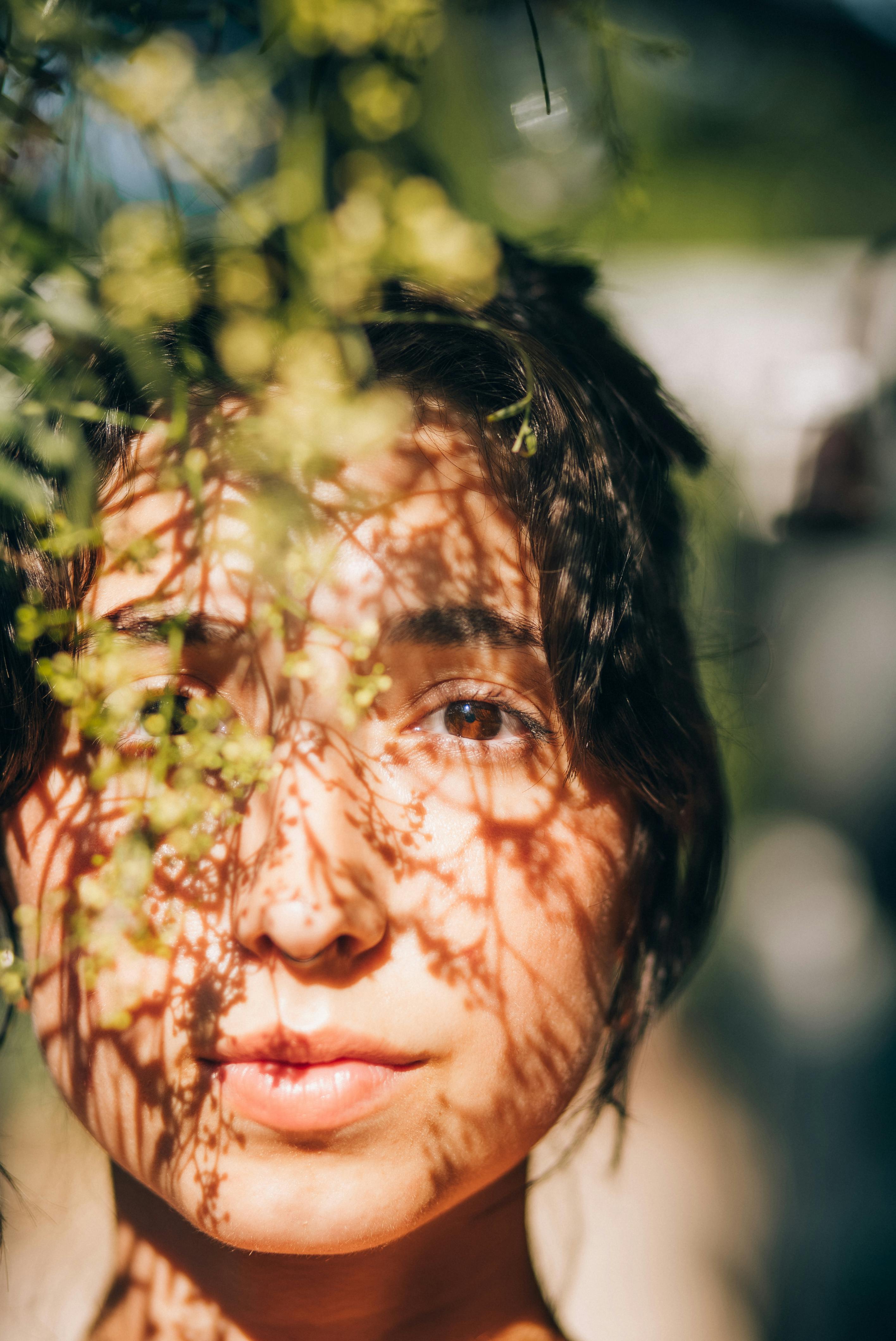 Shadow of Twigs on Woman Face · Free Stock Photo