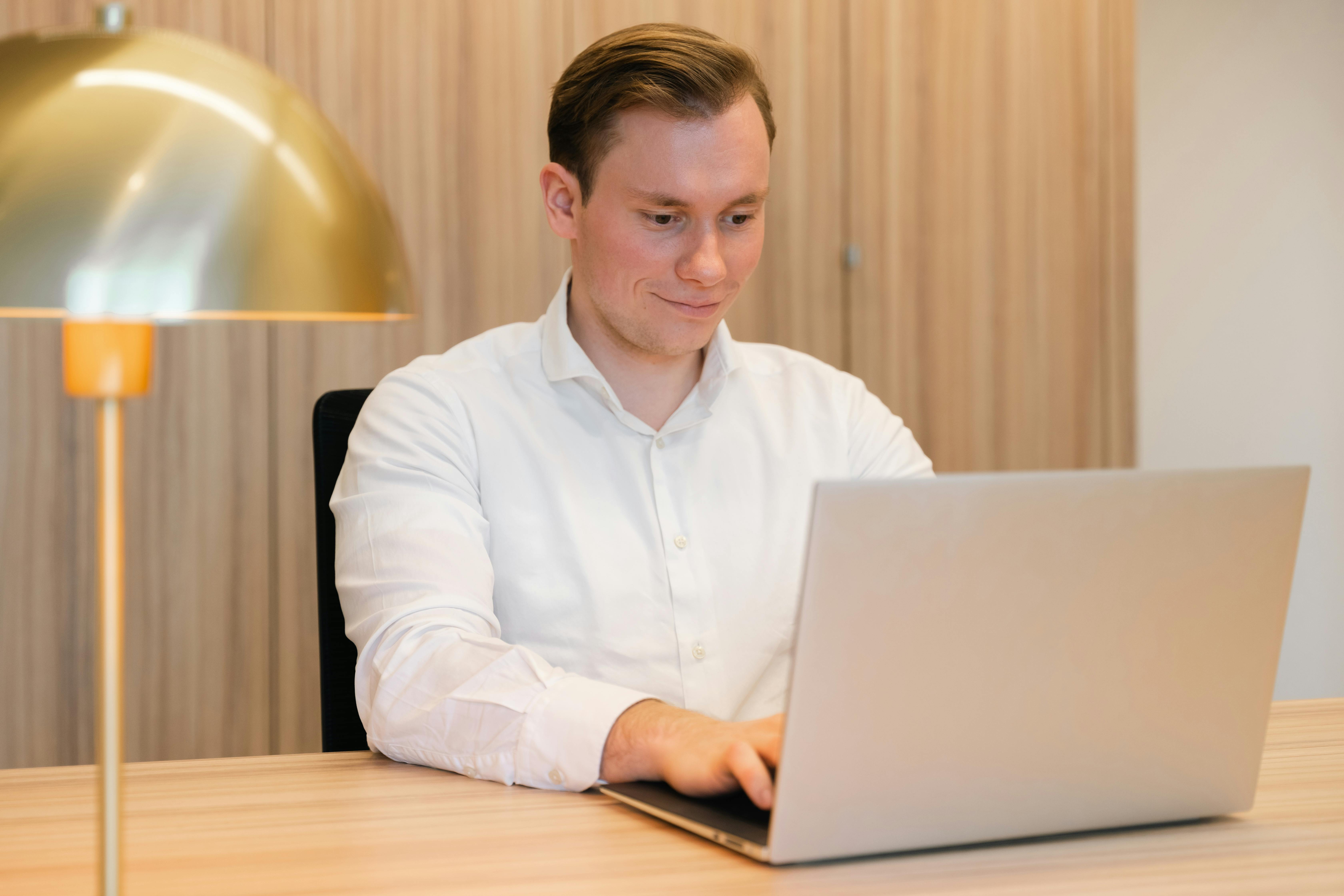 Man Using Apple Laptop · Free Stock Photo