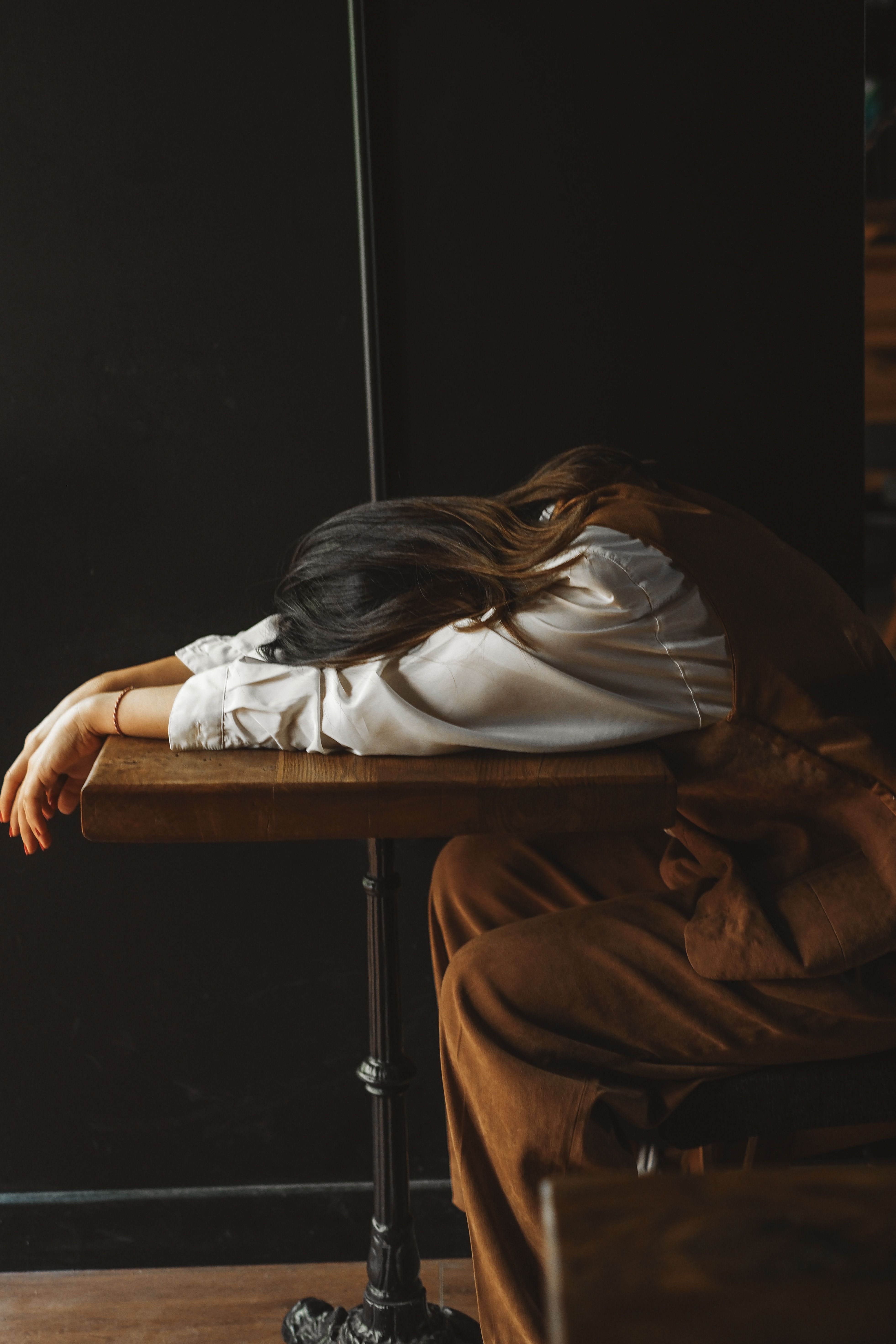 Woman Lying on Table in Bar · Free Stock Photo