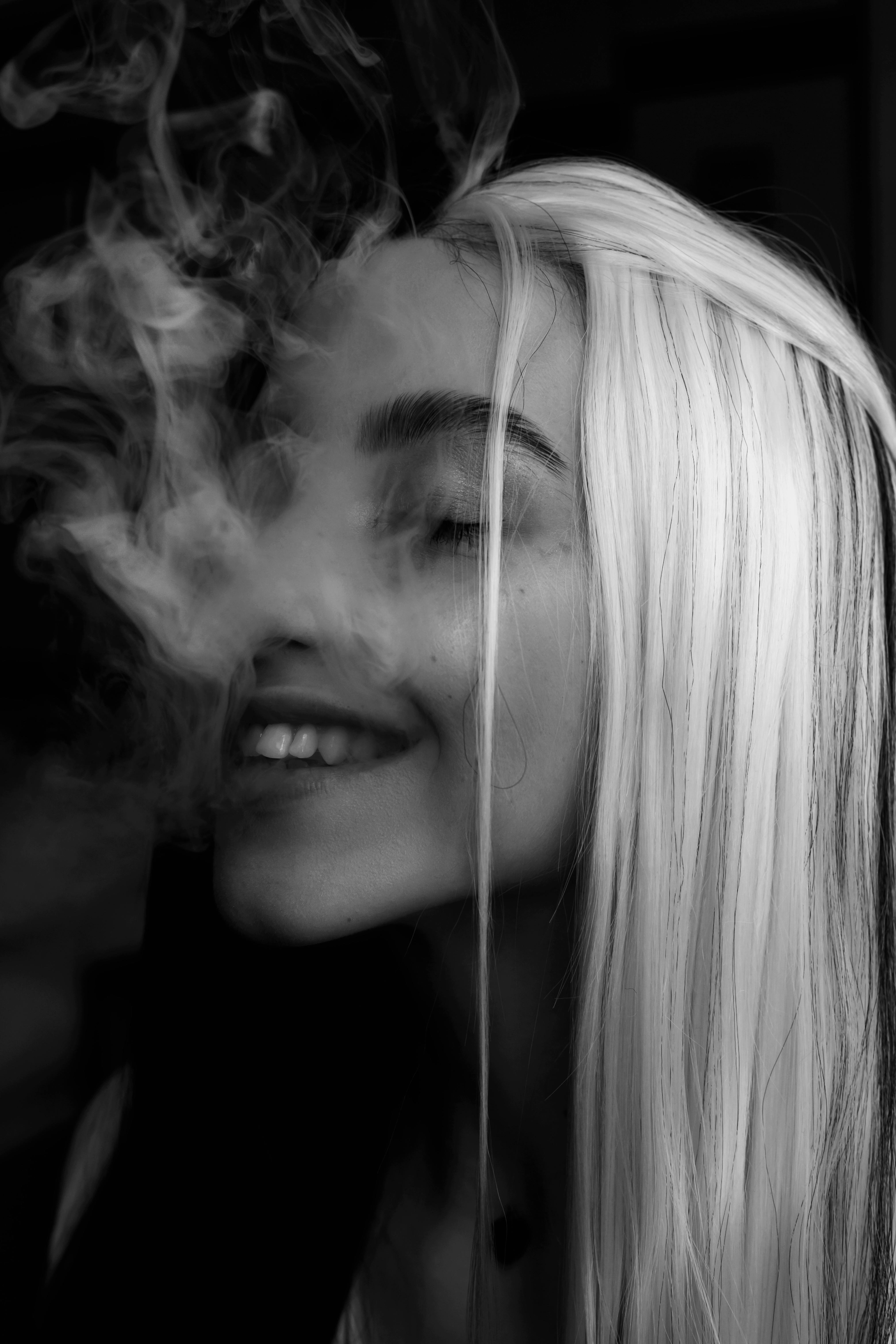 Smiling Blonde Smoking · Free Stock Photo