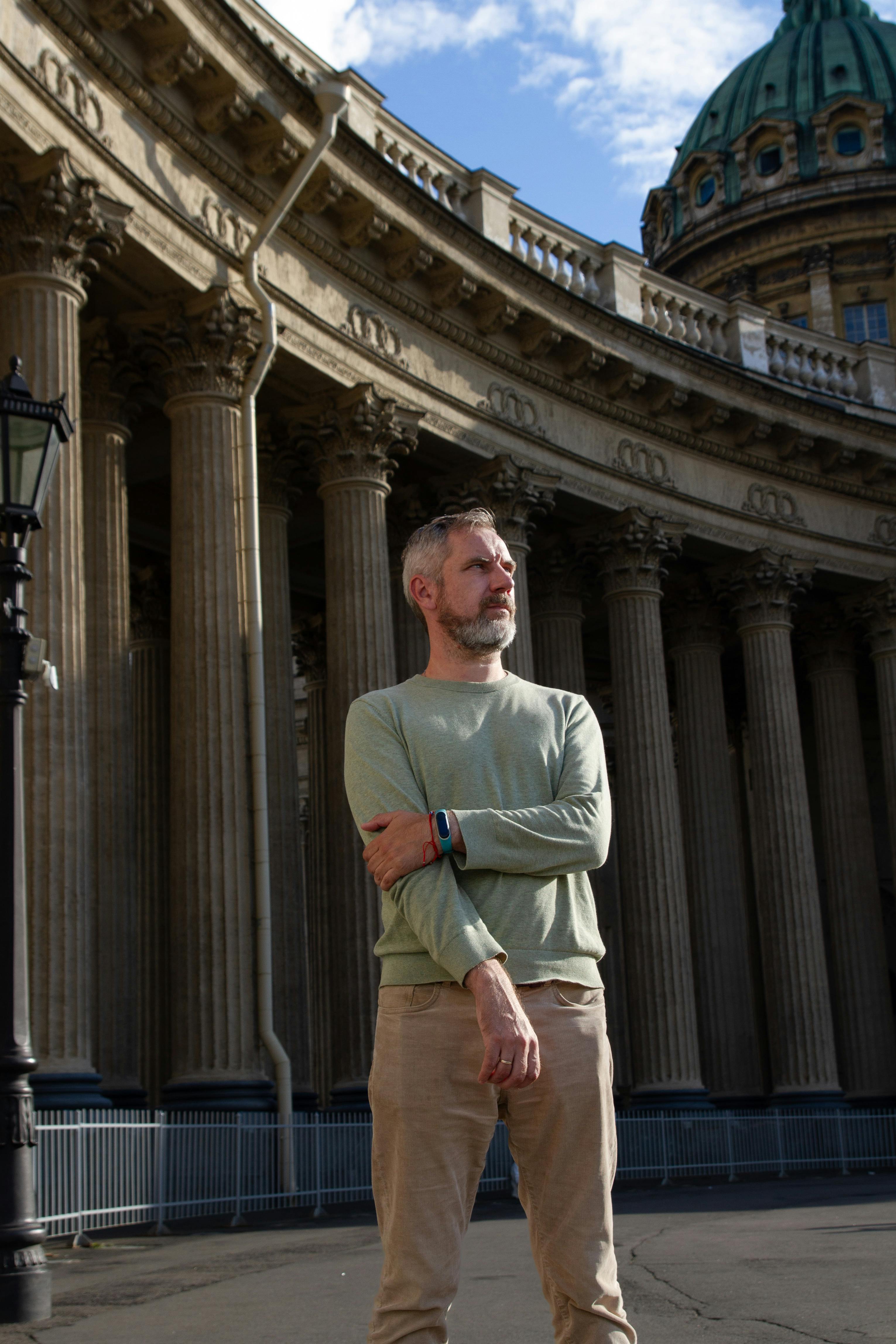 Man Standing in front of Colonnade · Free Stock Photo