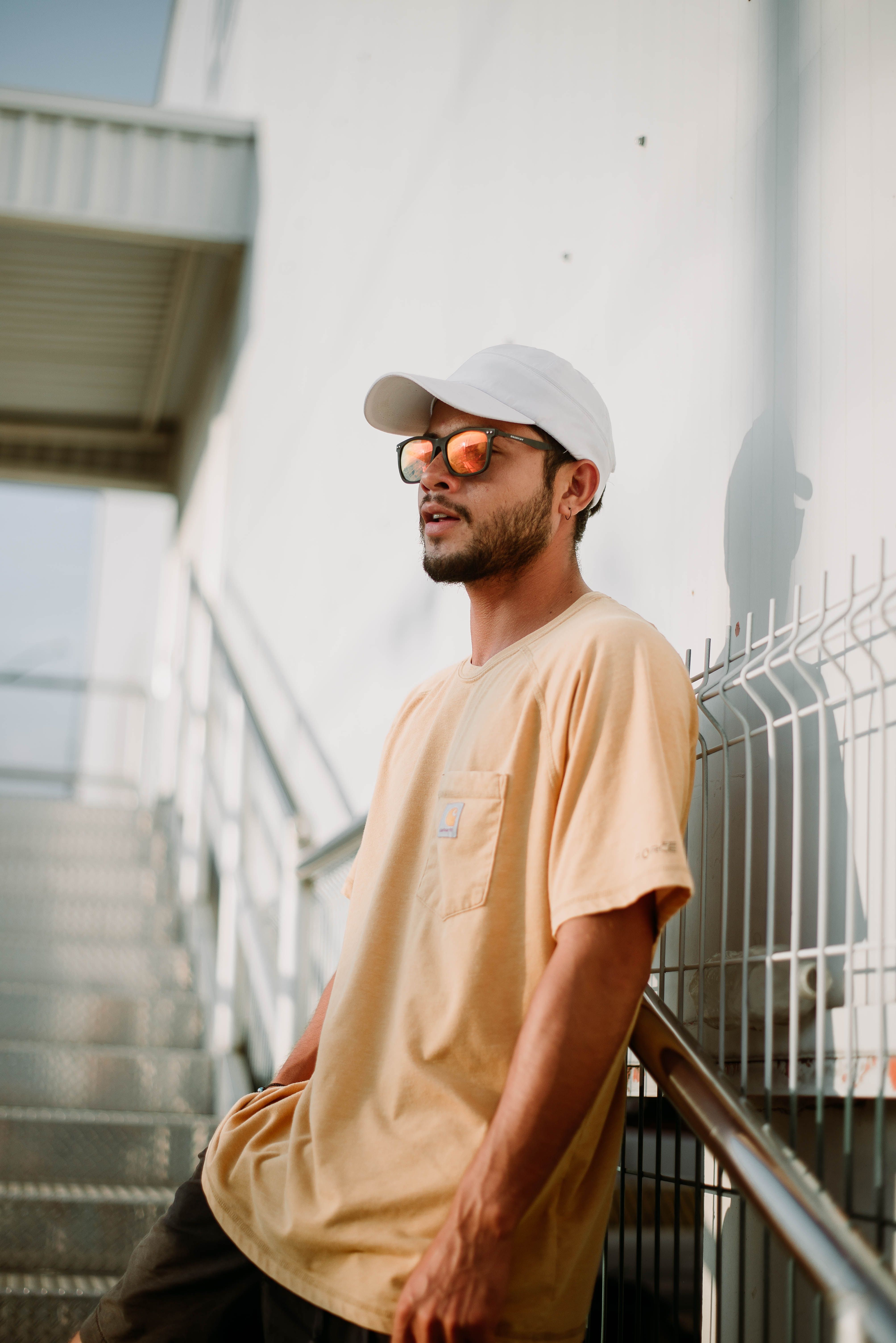 Smiling Man Wearing Black Snapback Cap and Black Crew-neck Shirt · Free ...