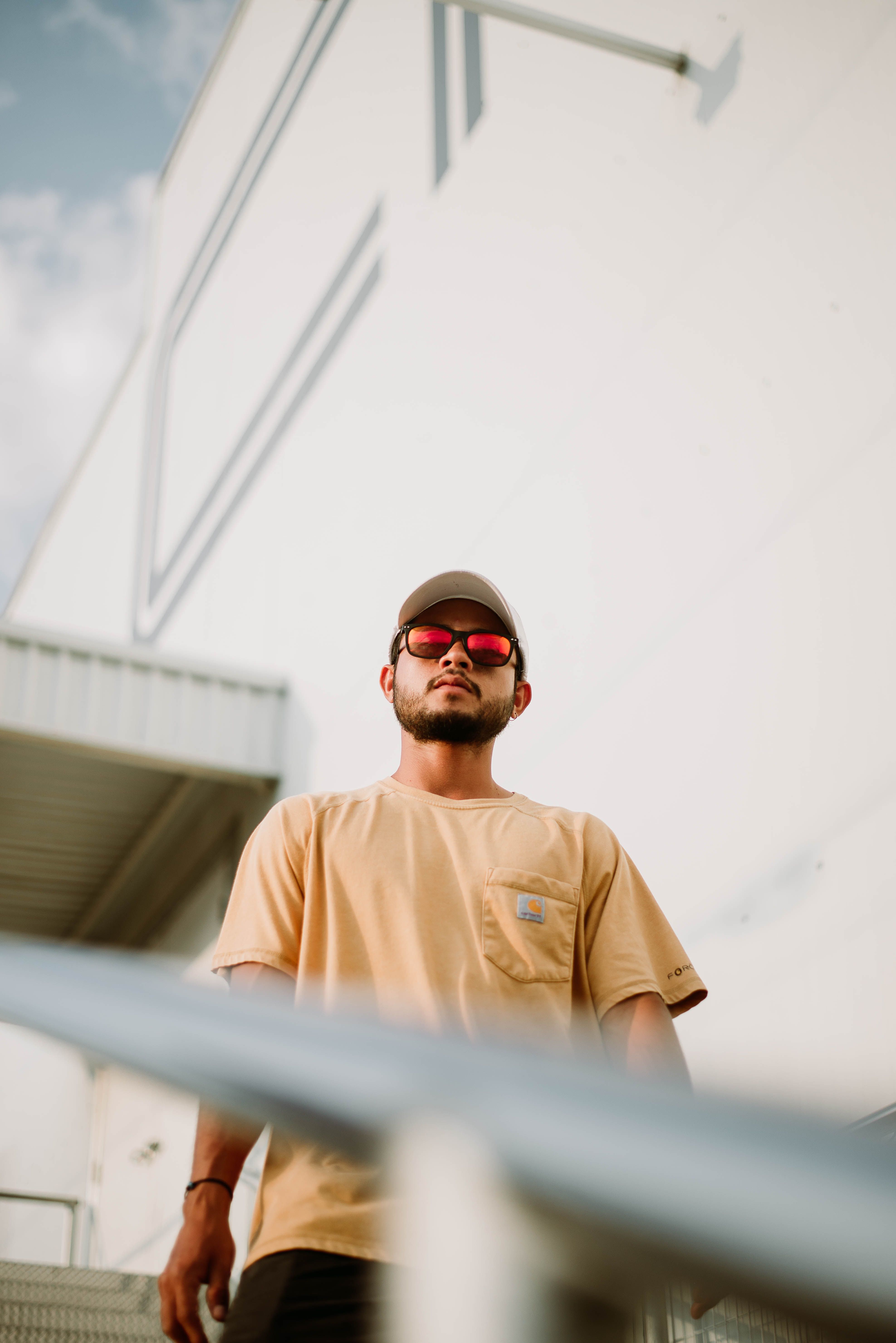 Back View of Black Man in Baseball Hat and T-Shirt · Free Stock Photo