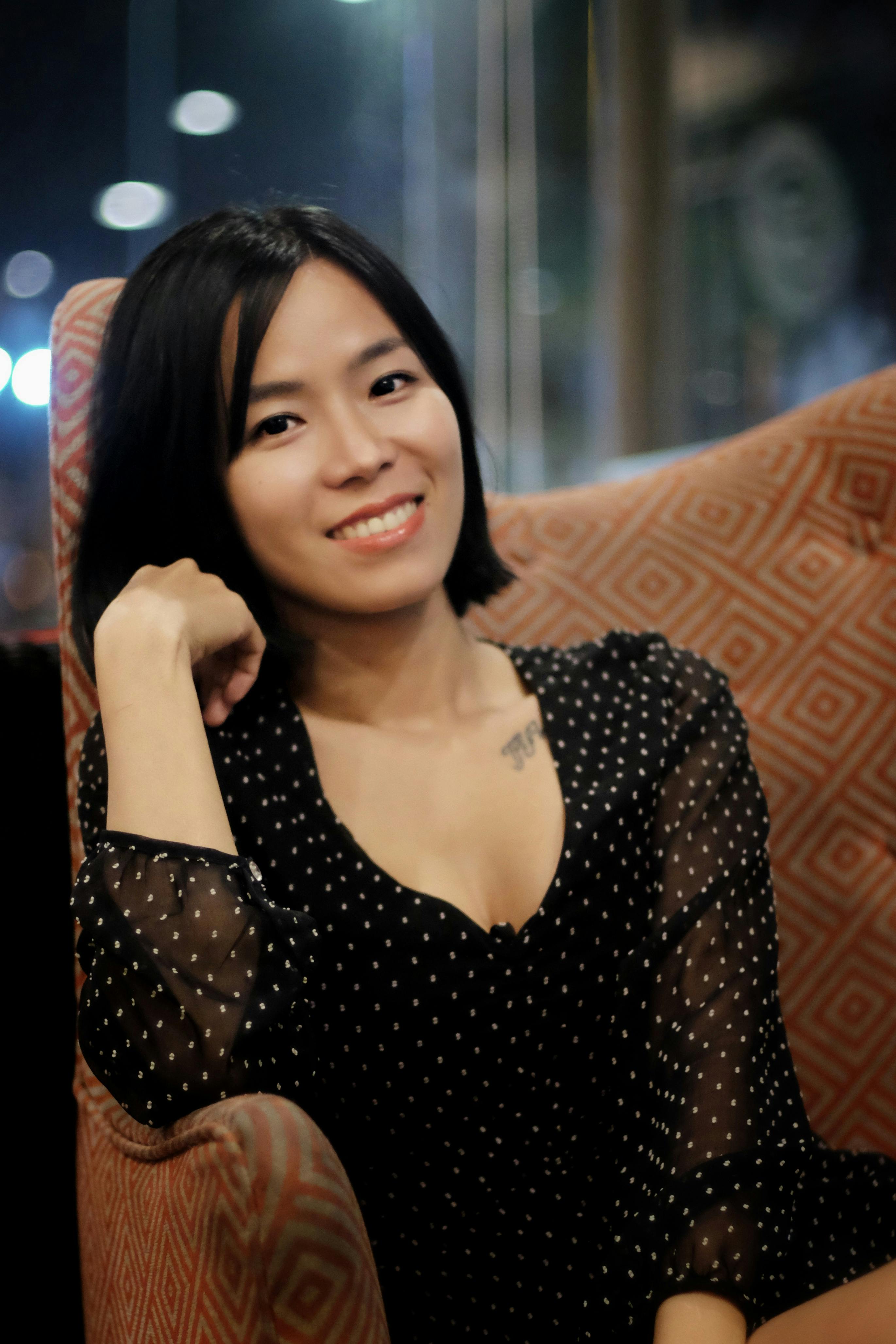 Woman Sitting and Drinking at Restaurant · Free Stock Photo