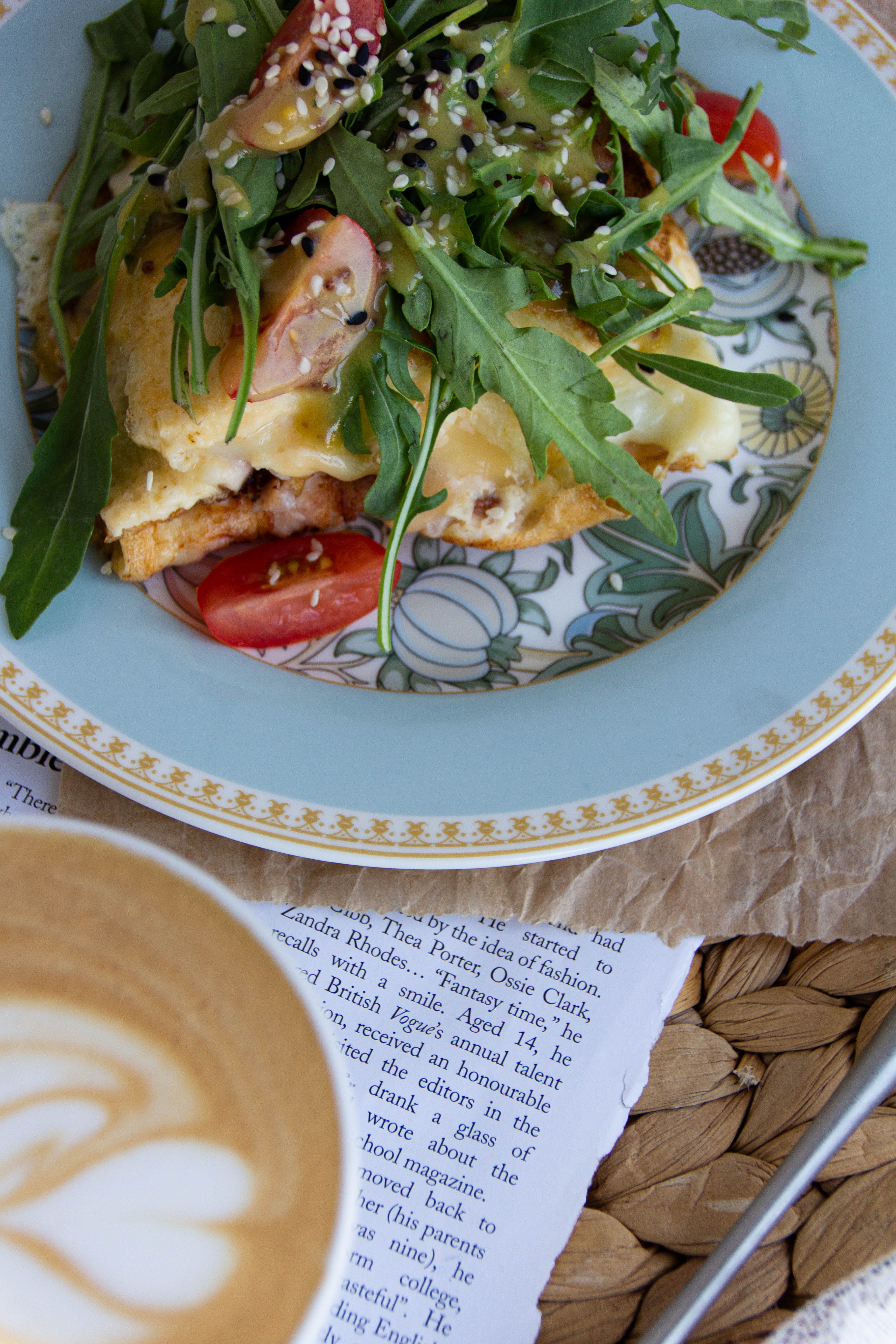 Plates with Breakfast, Cups of Coffee and Magazines on a Table · Free ...