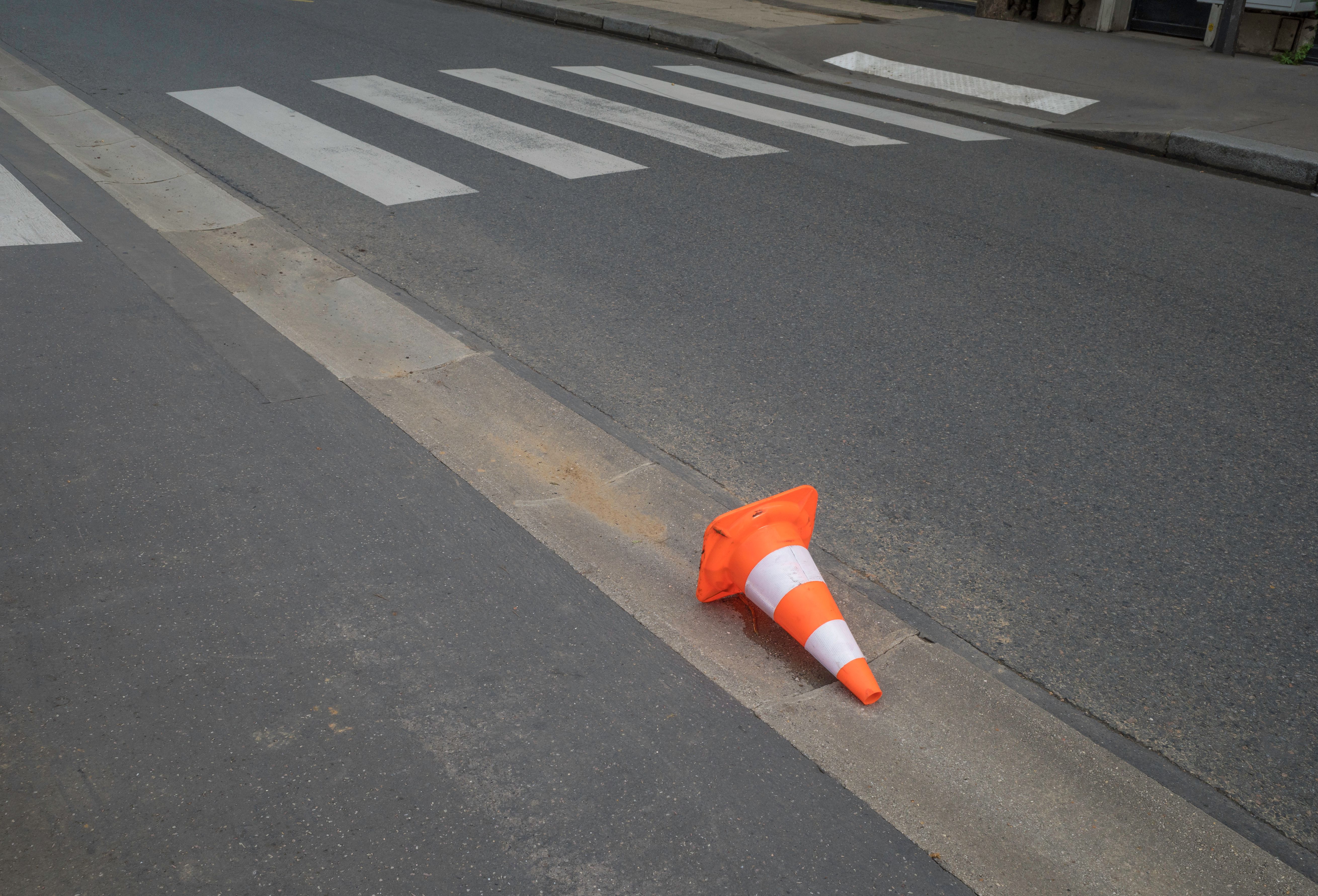 Traffic Cone Lying on Street · Free Stock Photo