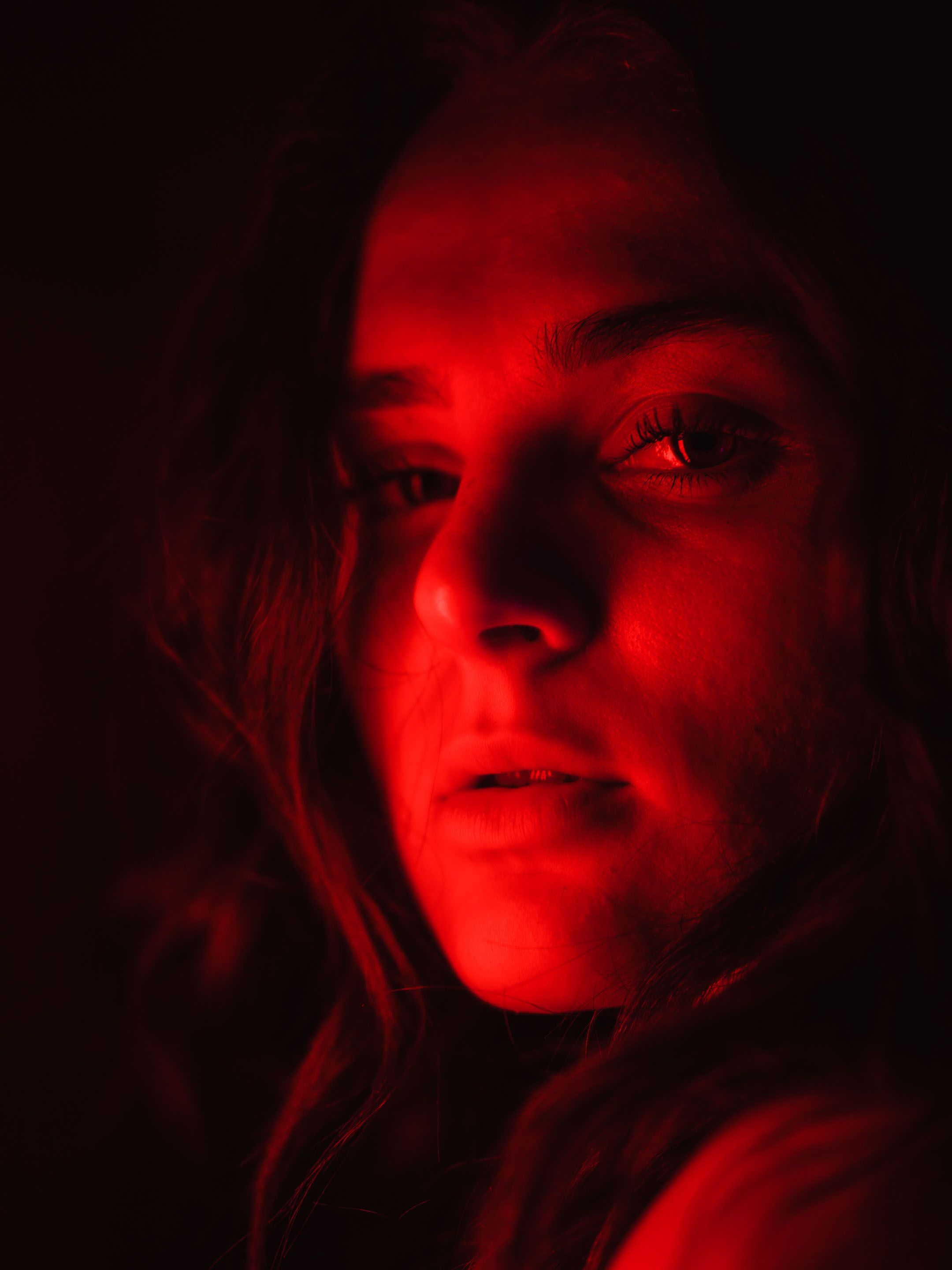 Portrait of Young Woman in Red Light · Free Stock Photo