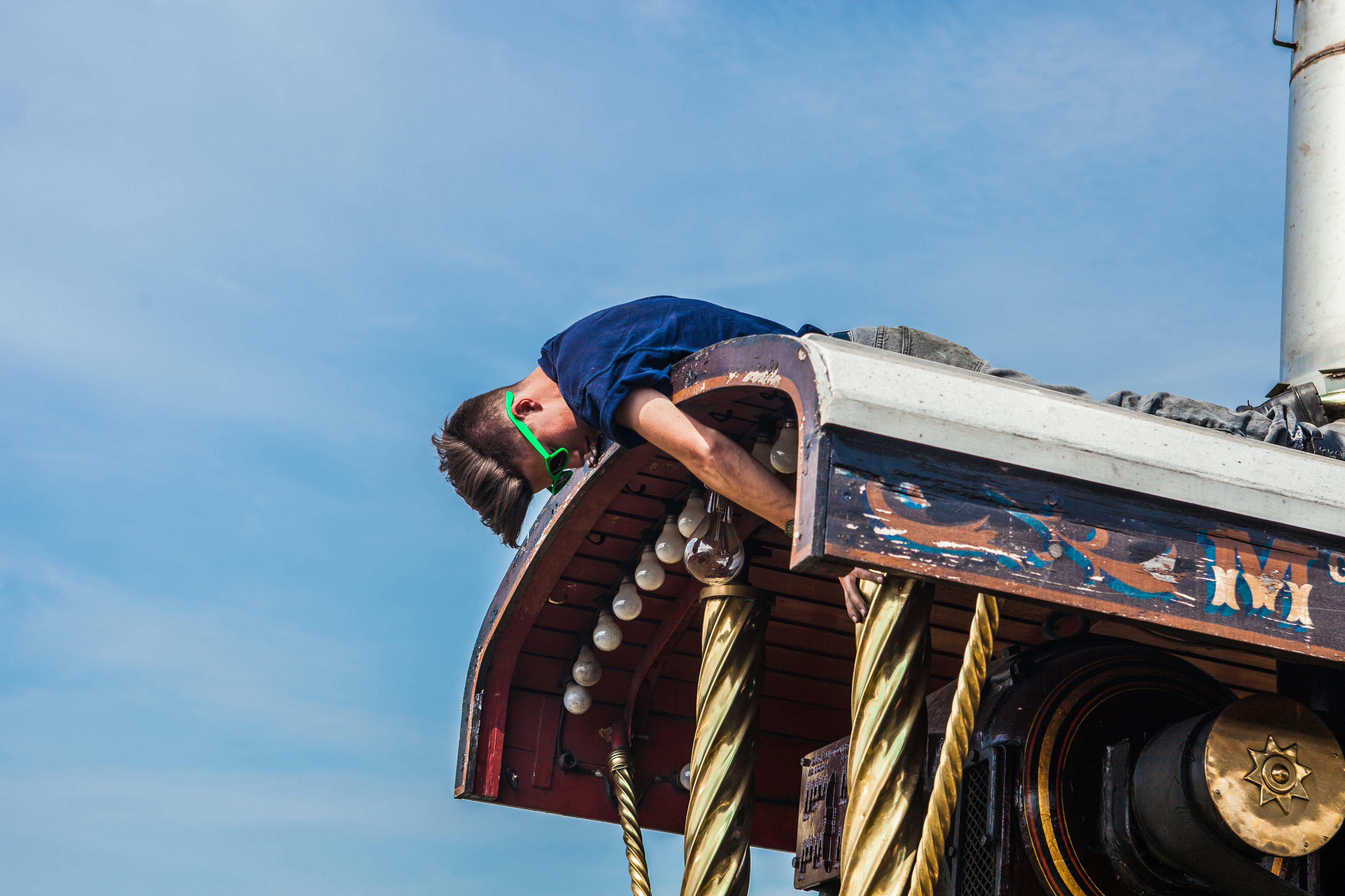 Man on Roof during Daytime · Free Stock Photo