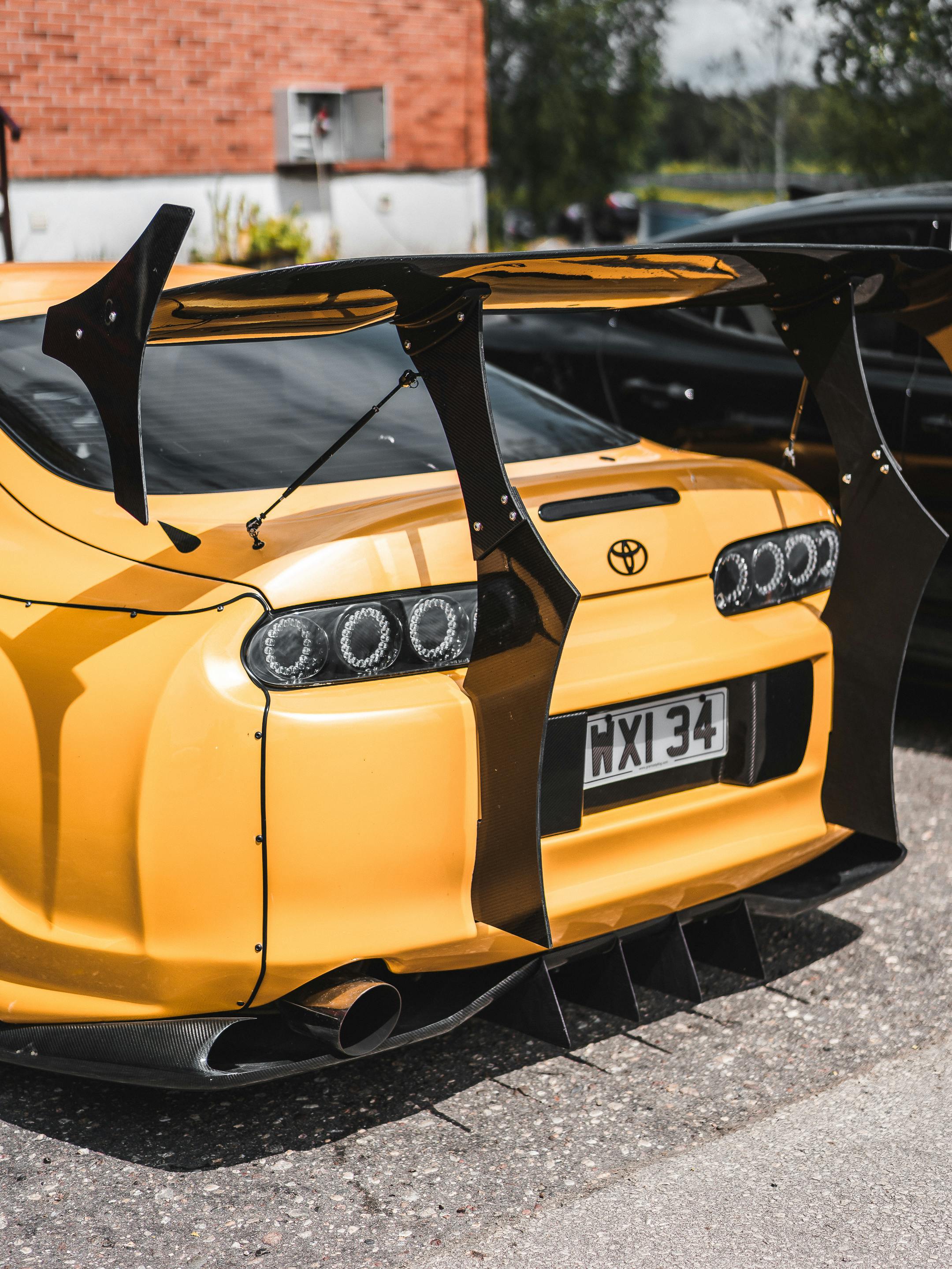 Modern Yellow Car on Parking Lot · Free Stock Photo