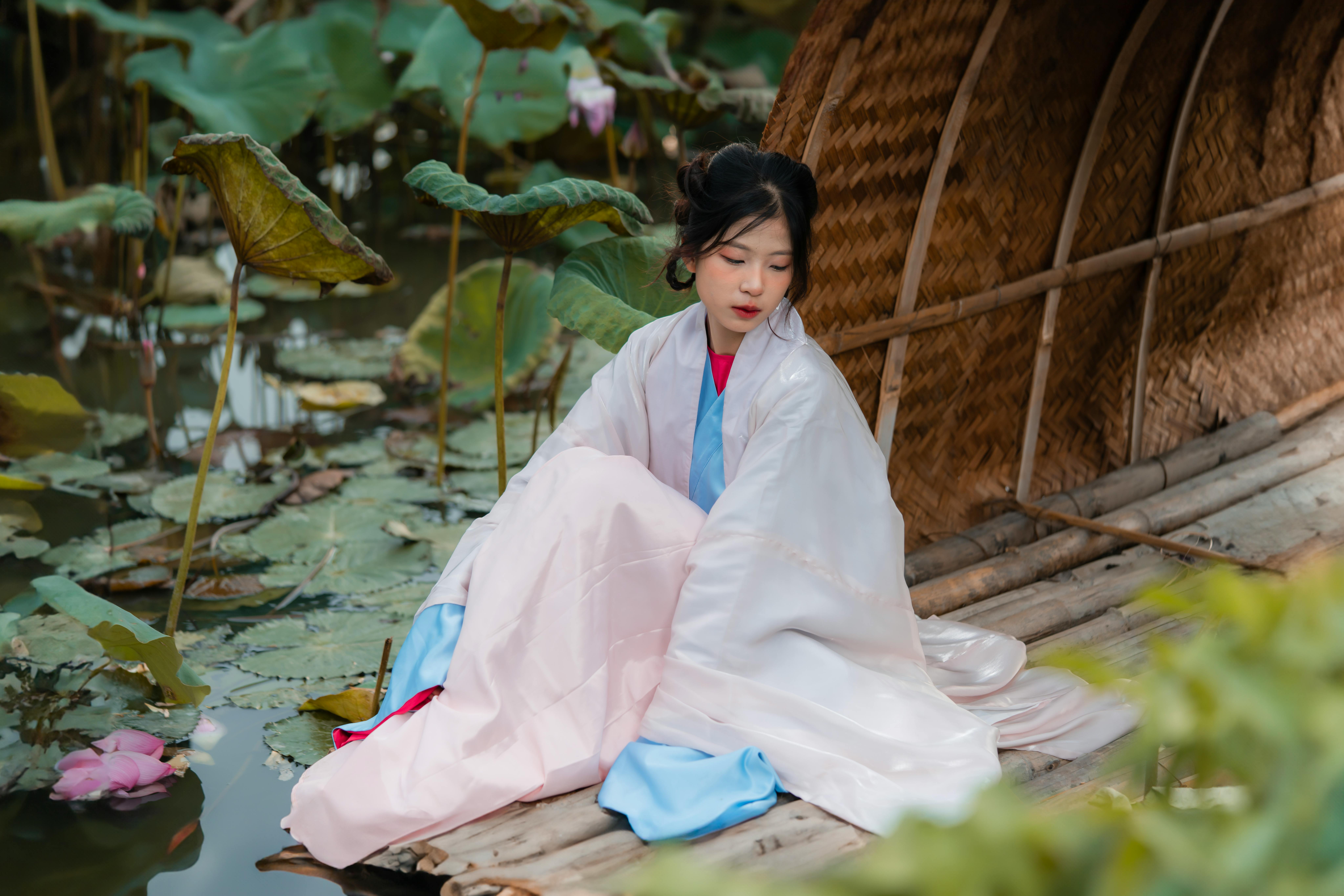 Young Woman in a Traditional Chinese Hanfu Posing Outside · Free Stock ...