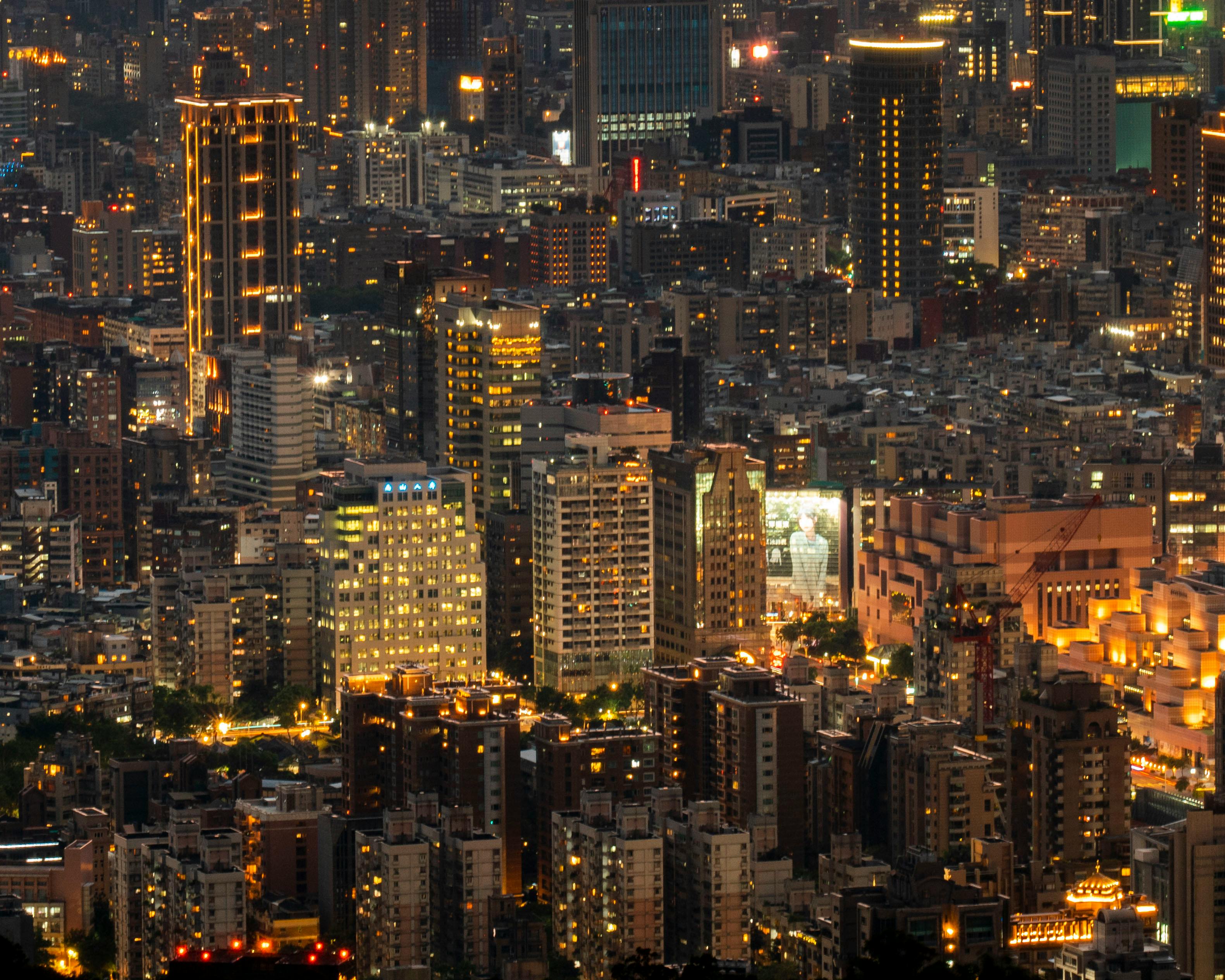 High-Rise Buildings at Night · Free Stock Photo