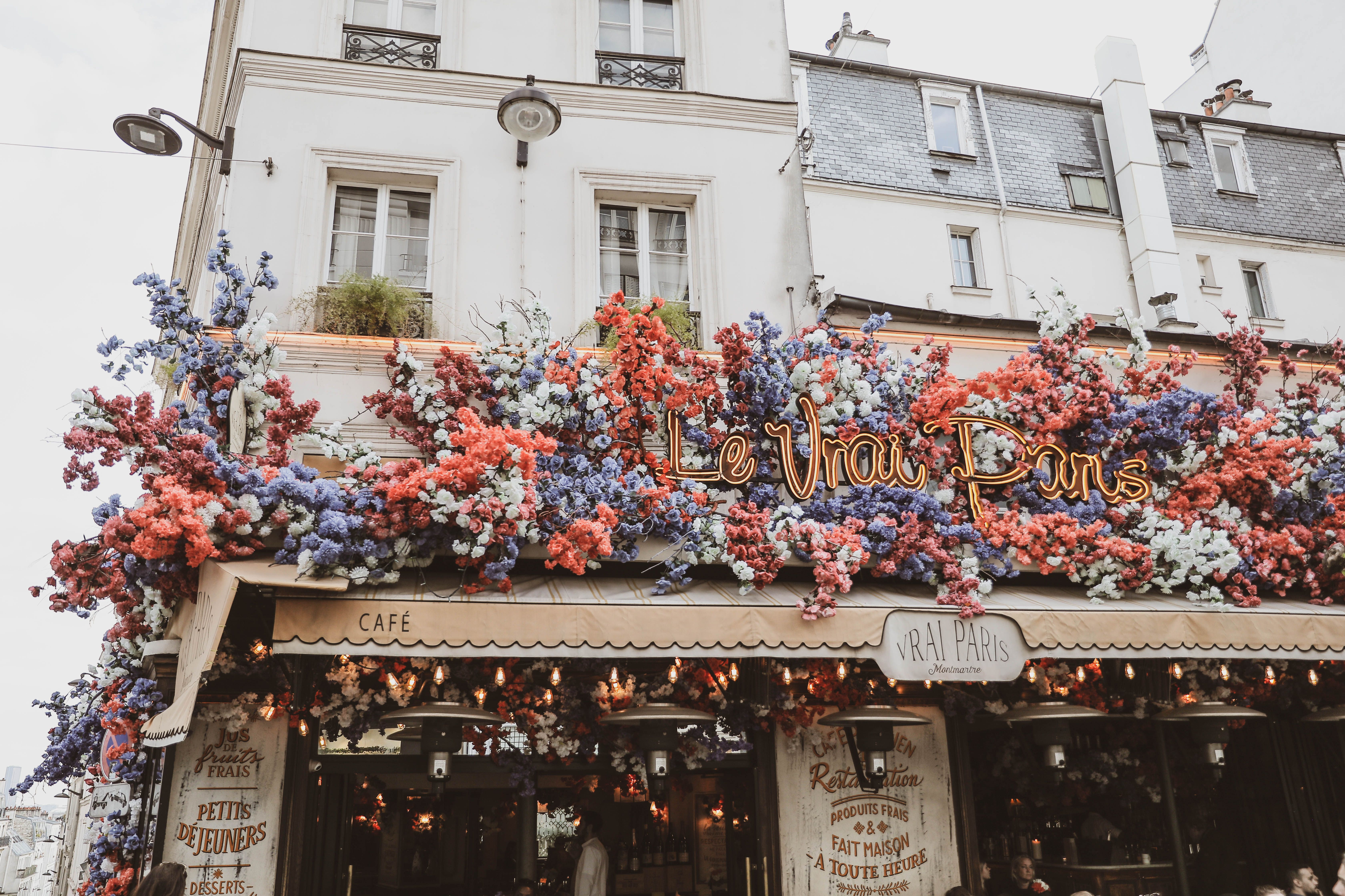 Flowers Decor on Cafe Facade · Free Stock Photo