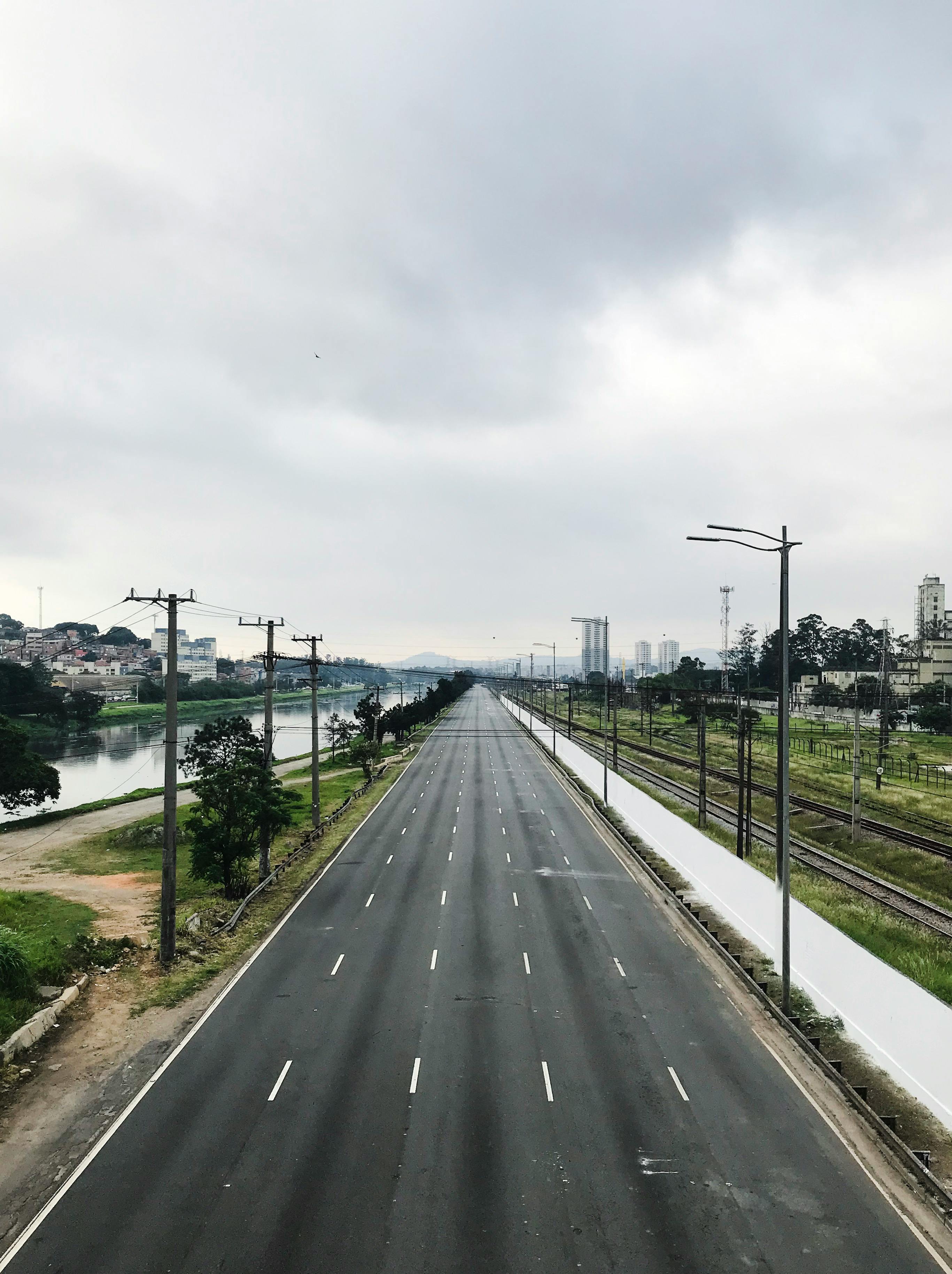 Brown Cardboard Box on Gray Asphalt Road · Free Stock Photo