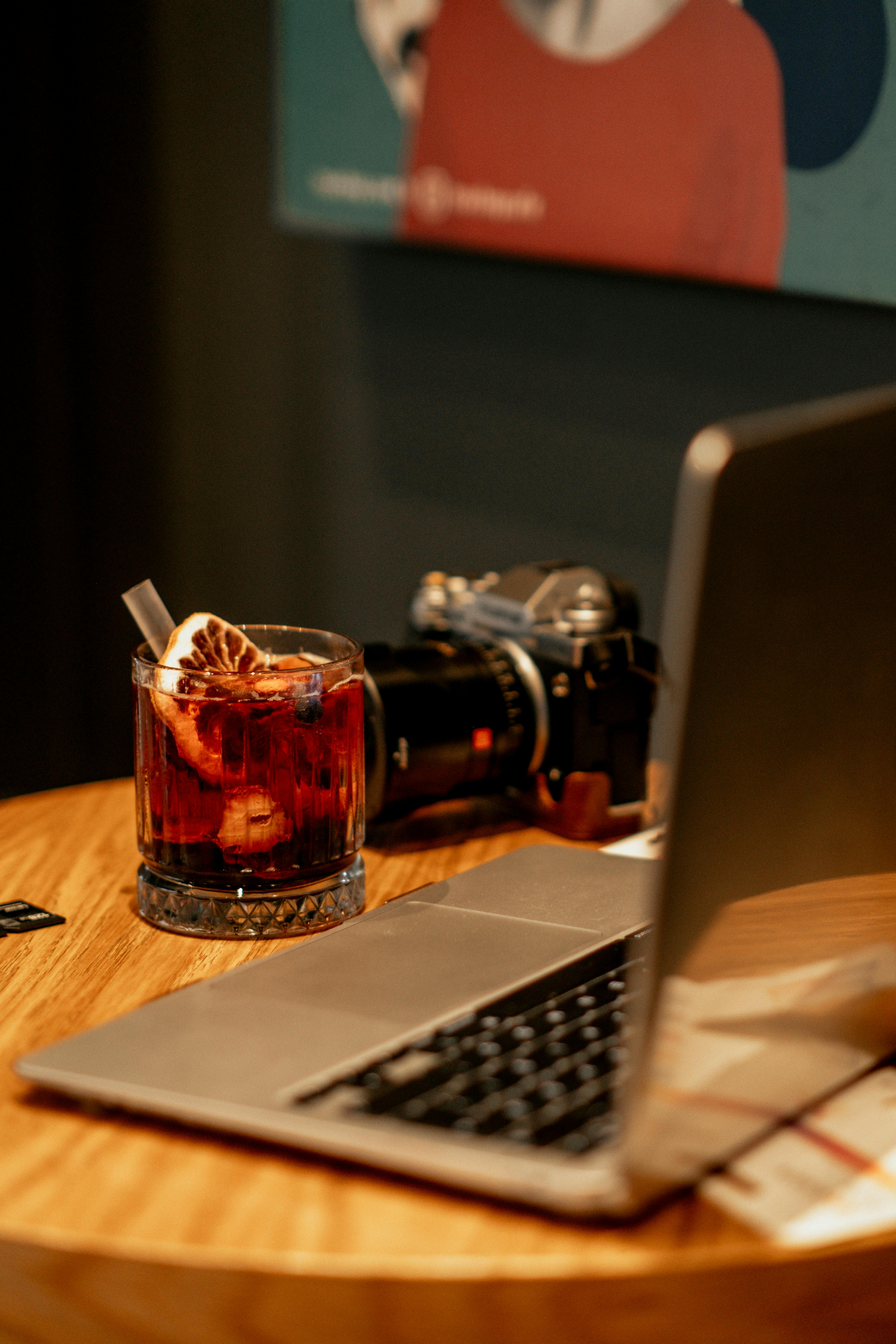 Glass of Tea, Camera and Laptop on Table · Free Stock Photo