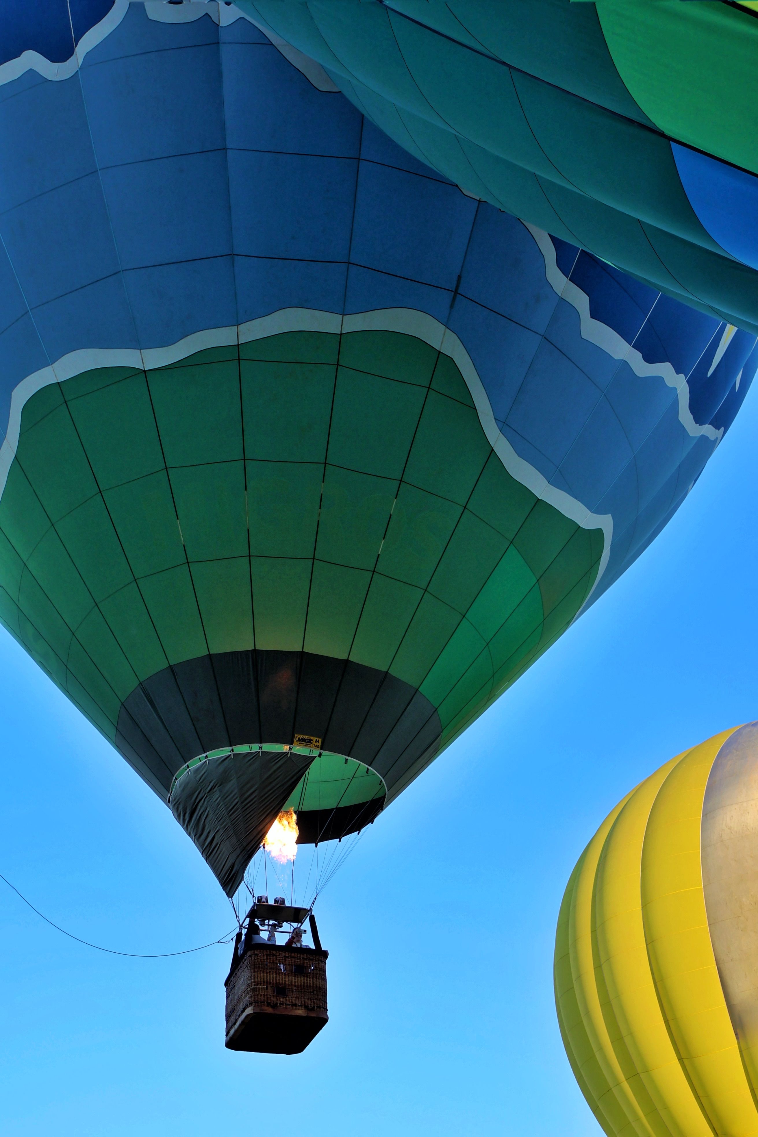 Colourful Balloon with Gondola in Clear Blue Sky · Free Stock Photo