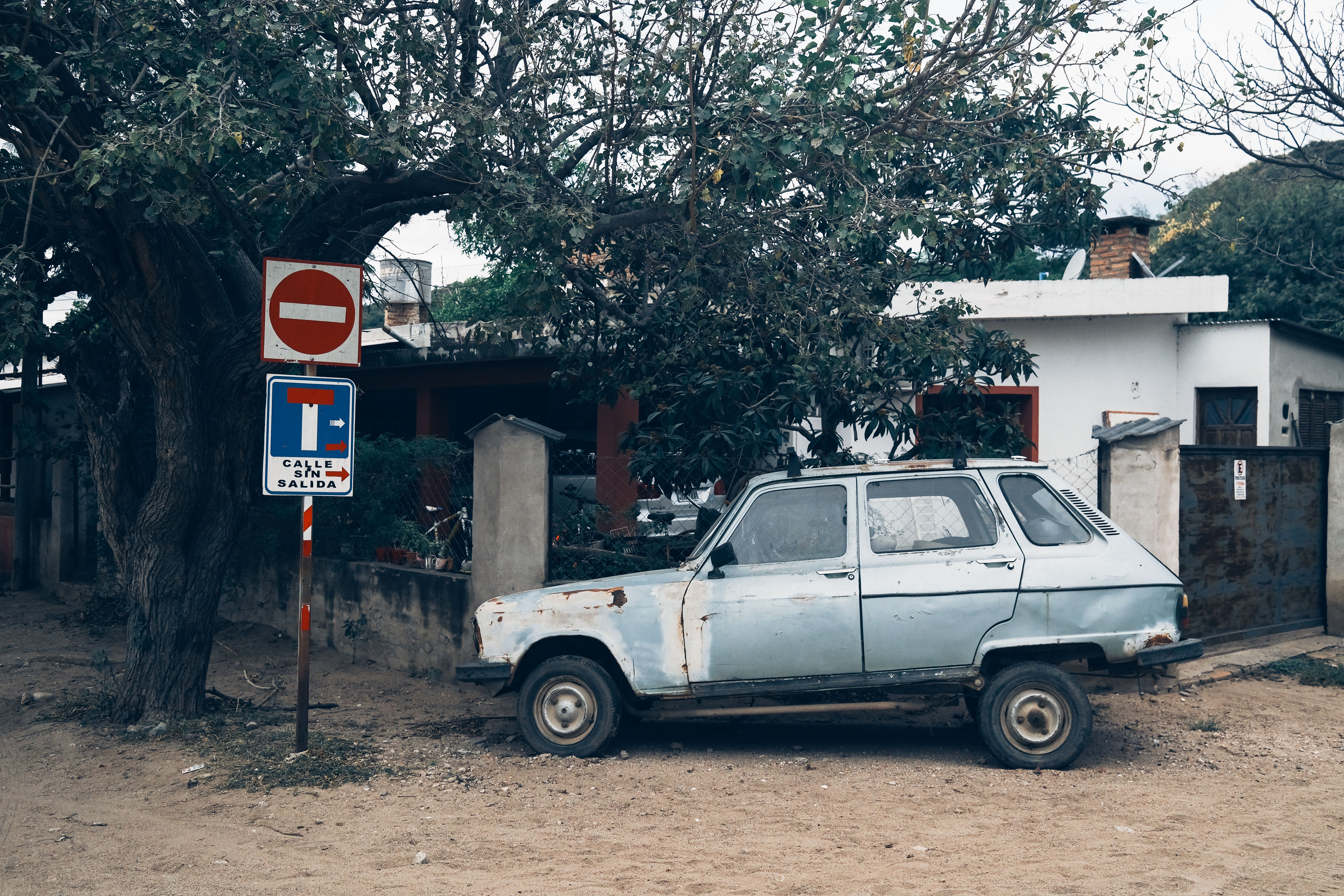 Neglected Car on Dirty Road · Free Stock Photo