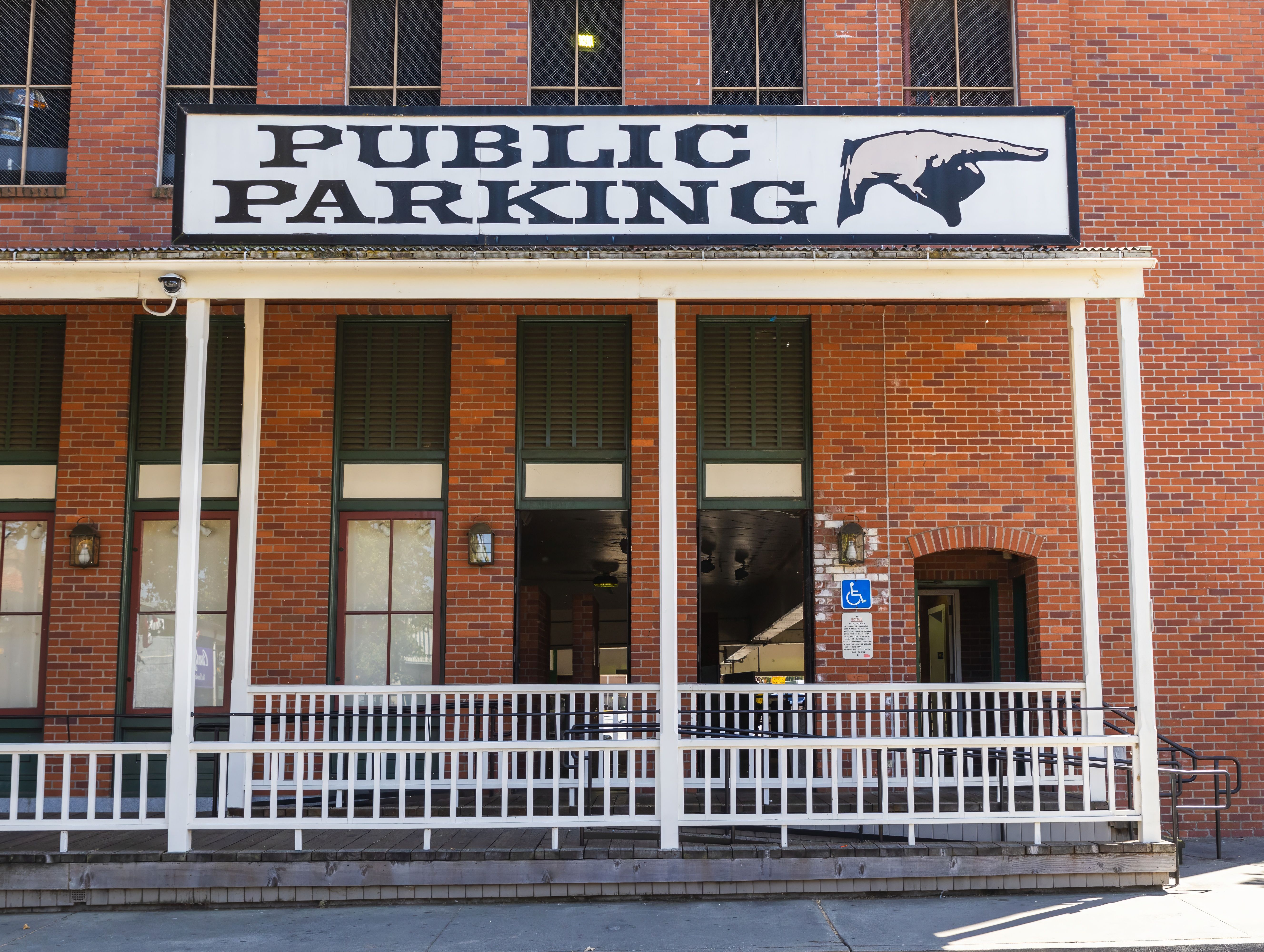 Sign on Brick Building Facade · Free Stock Photo