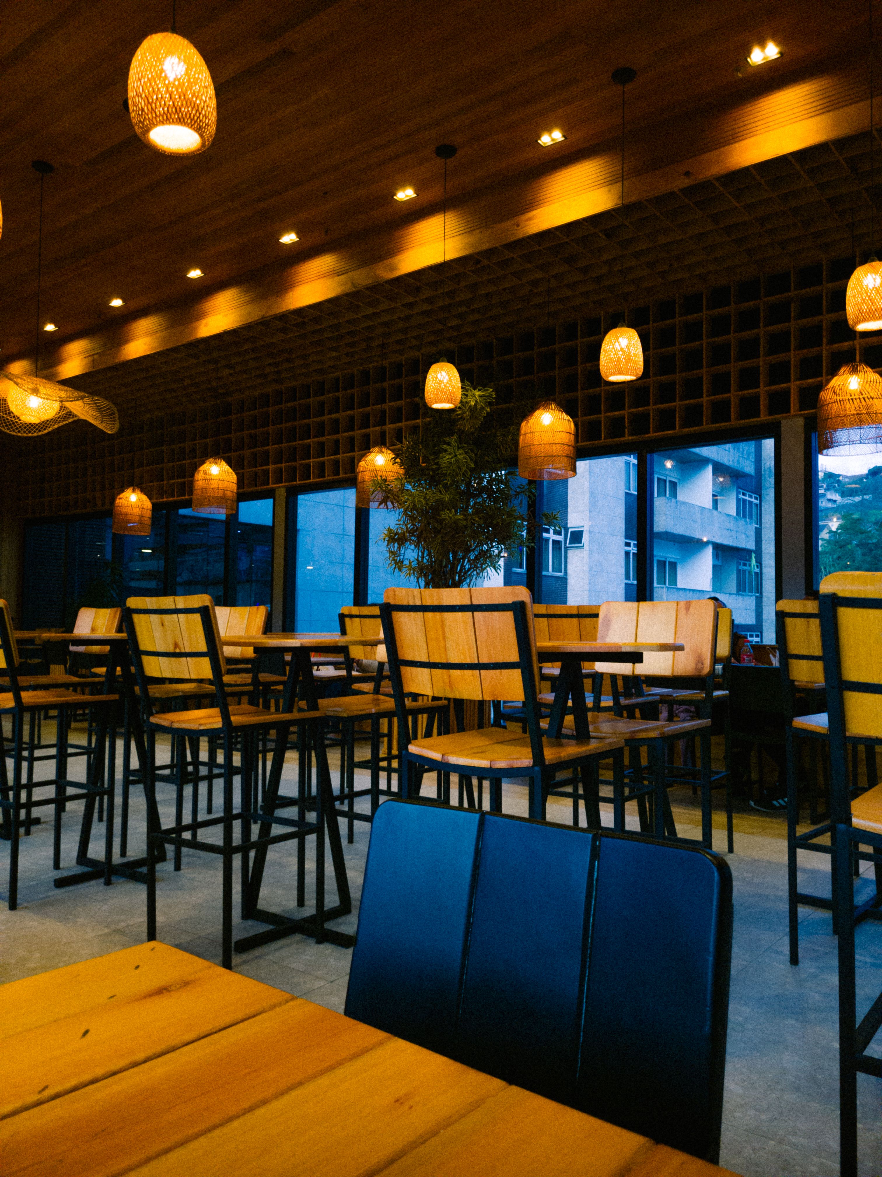 Lamps over Chairs and Tables in Restaurant · Free Stock Photo