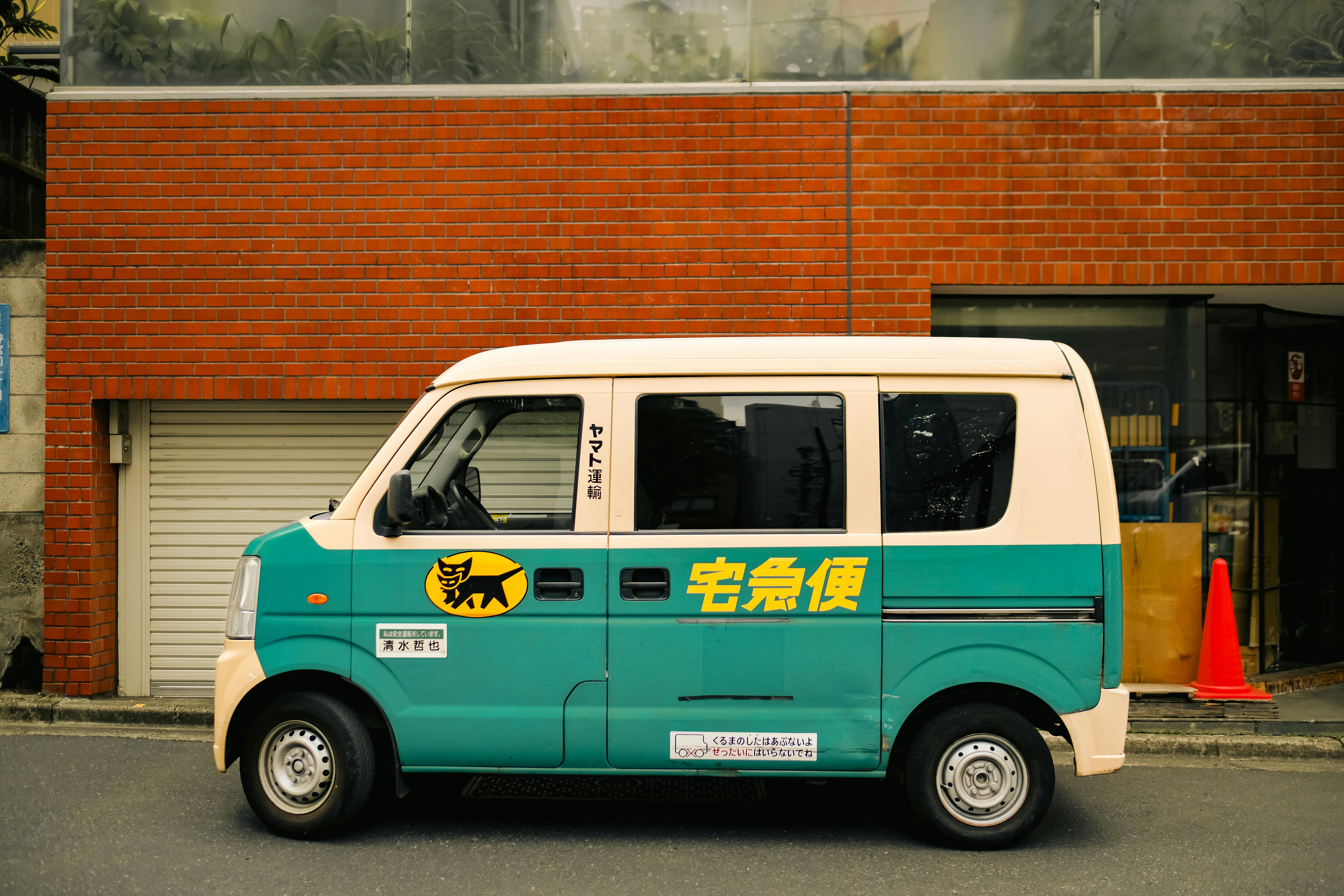 Retro Minivan on City Street · Free Stock Photo