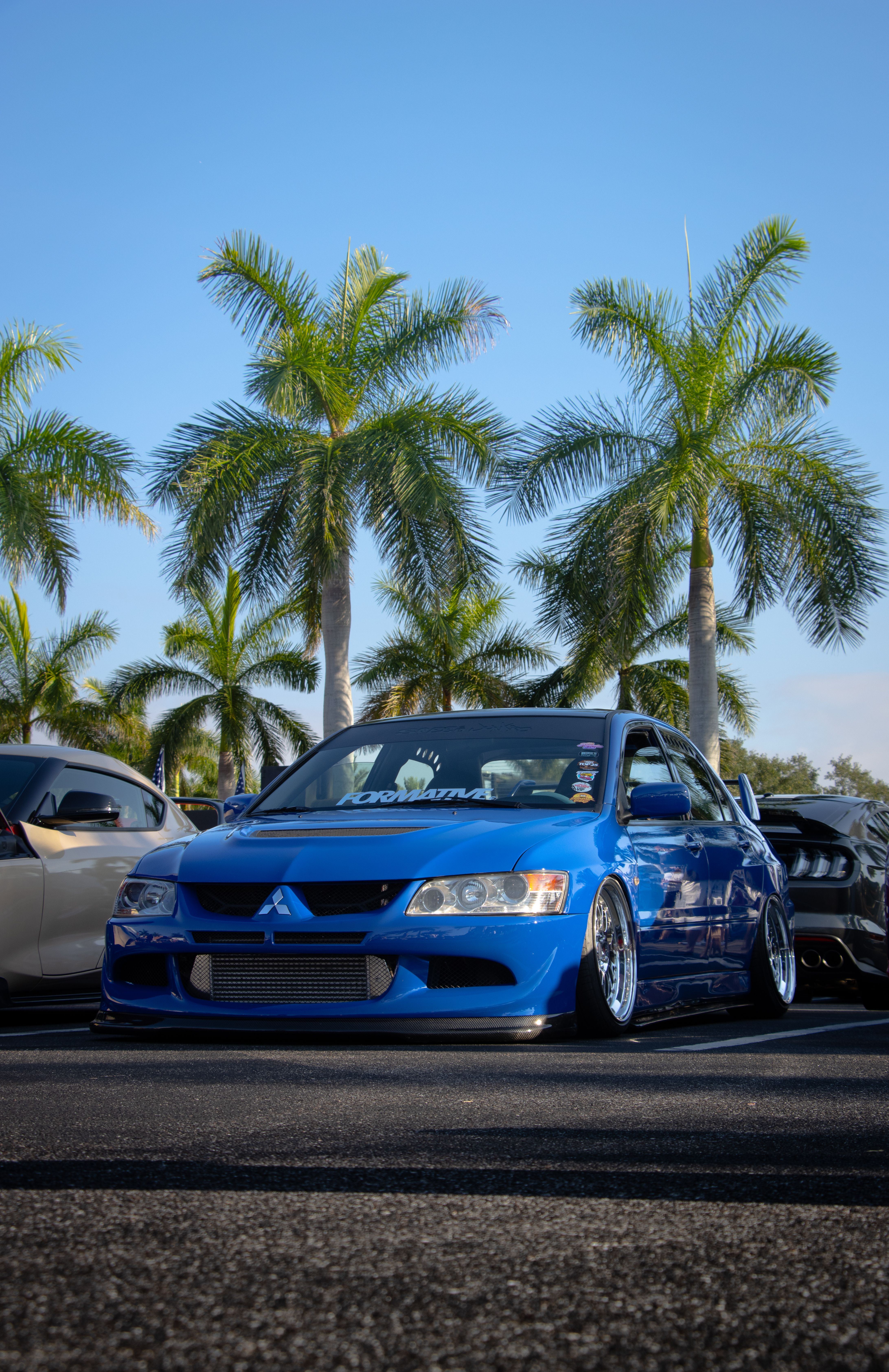 Sports Blue Car against Pam Trees · Free Stock Photo