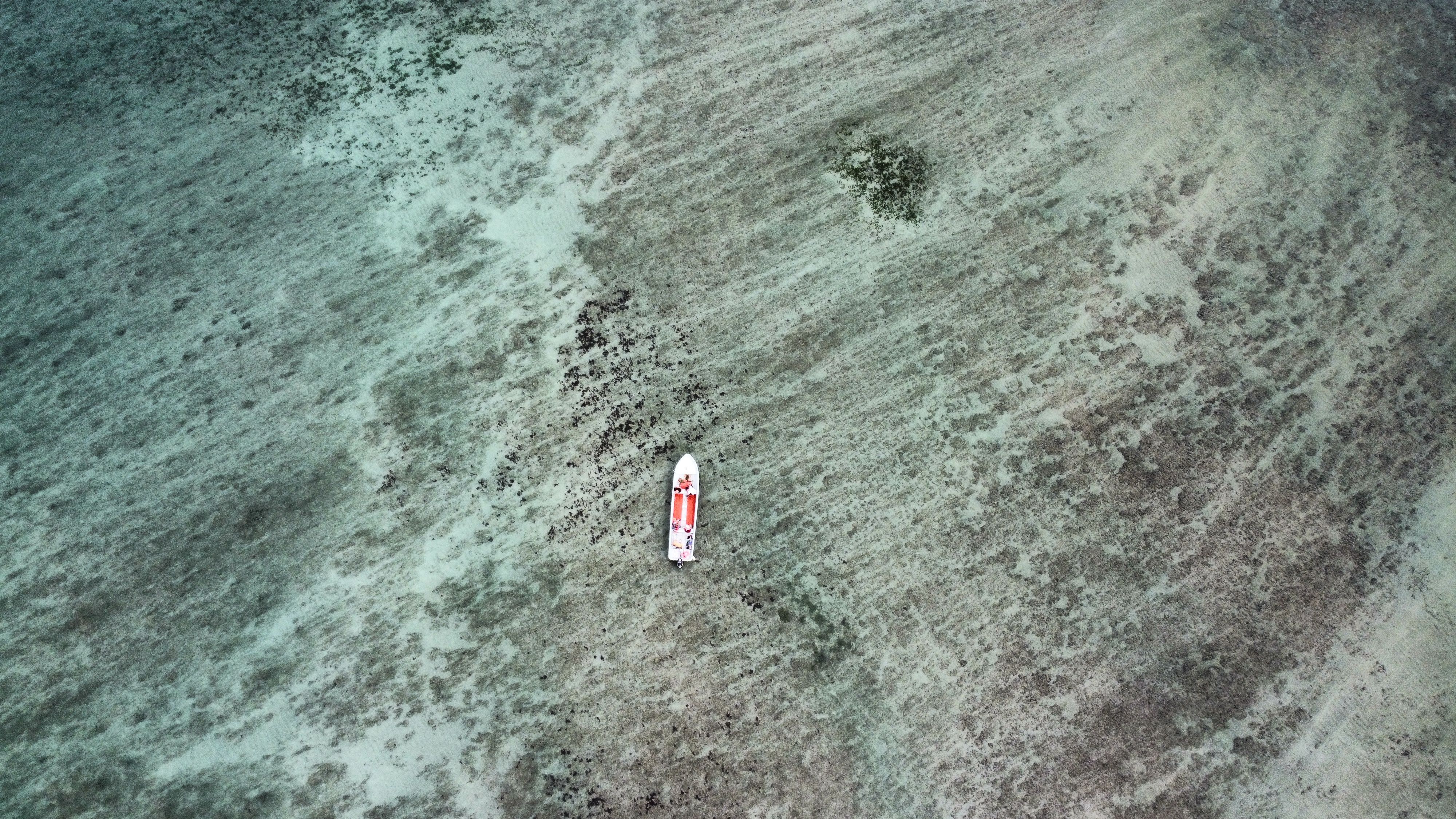 Aerial Photo of a Small Surf Board Lying on a Beach · Free Stock Photo
