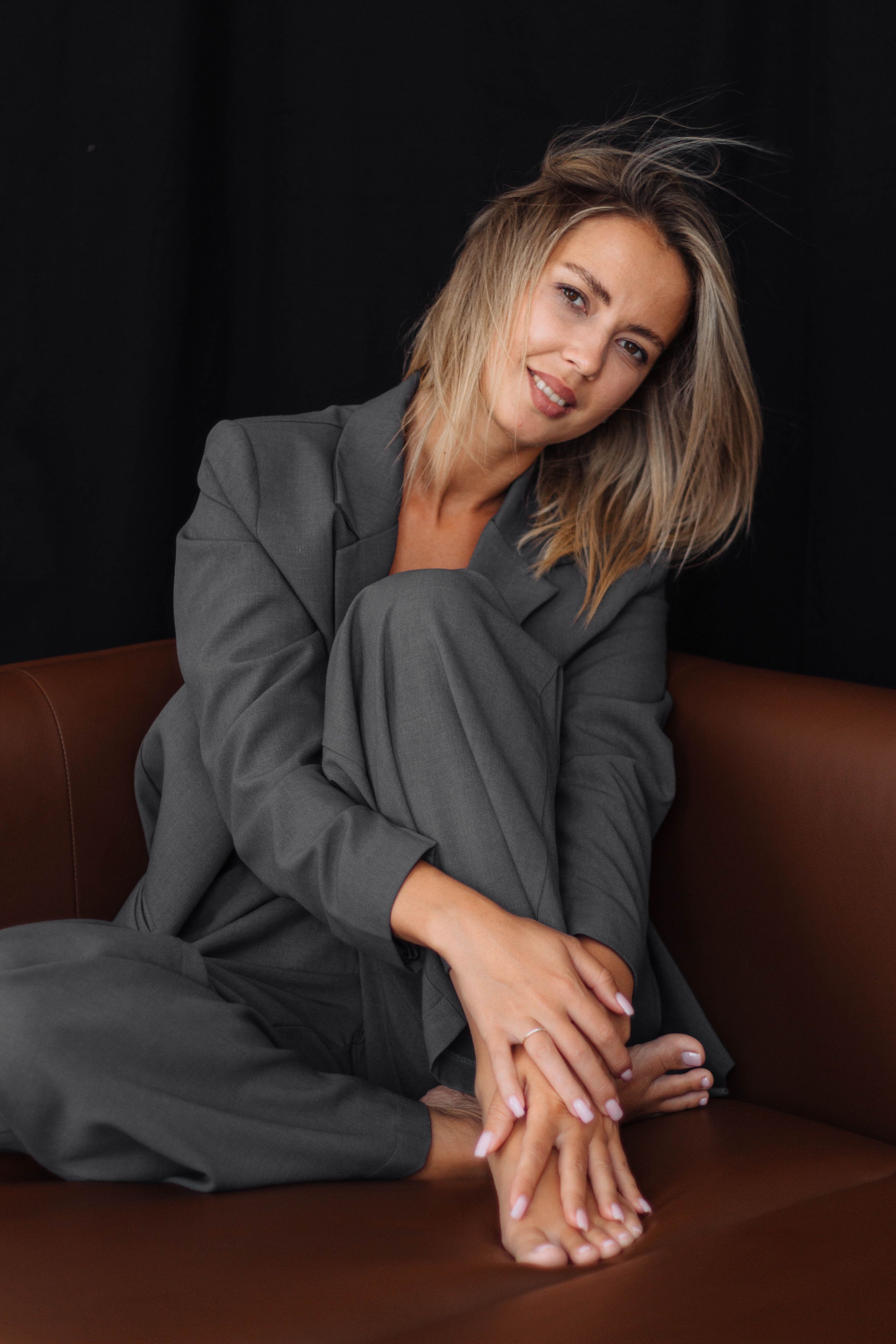 Young Woman Wearing an Elegant Blue Suit without a Shirt · Free Stock Photo