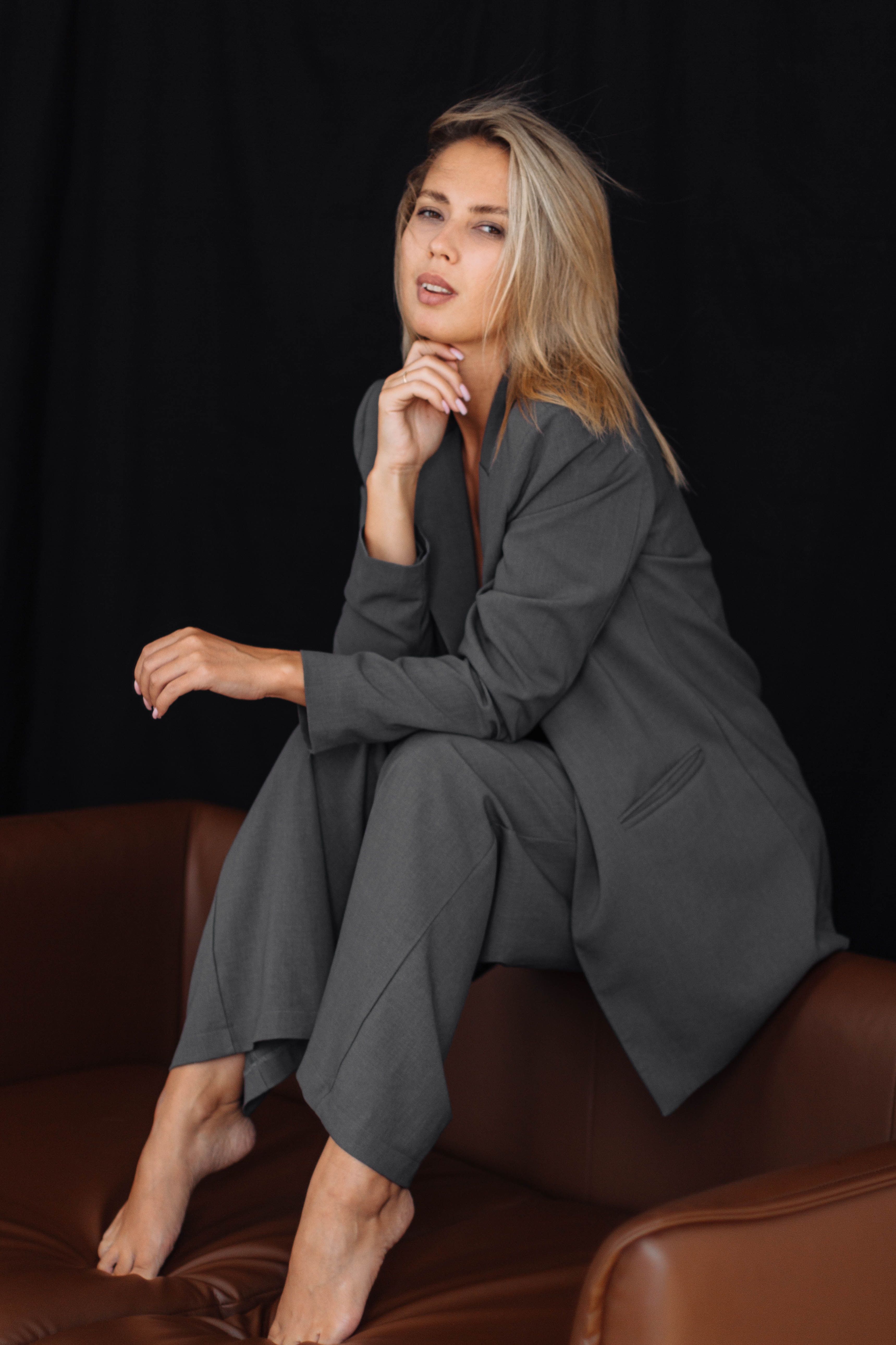 Young Woman Wearing an Elegant Blue Suit without a Shirt · Free Stock Photo