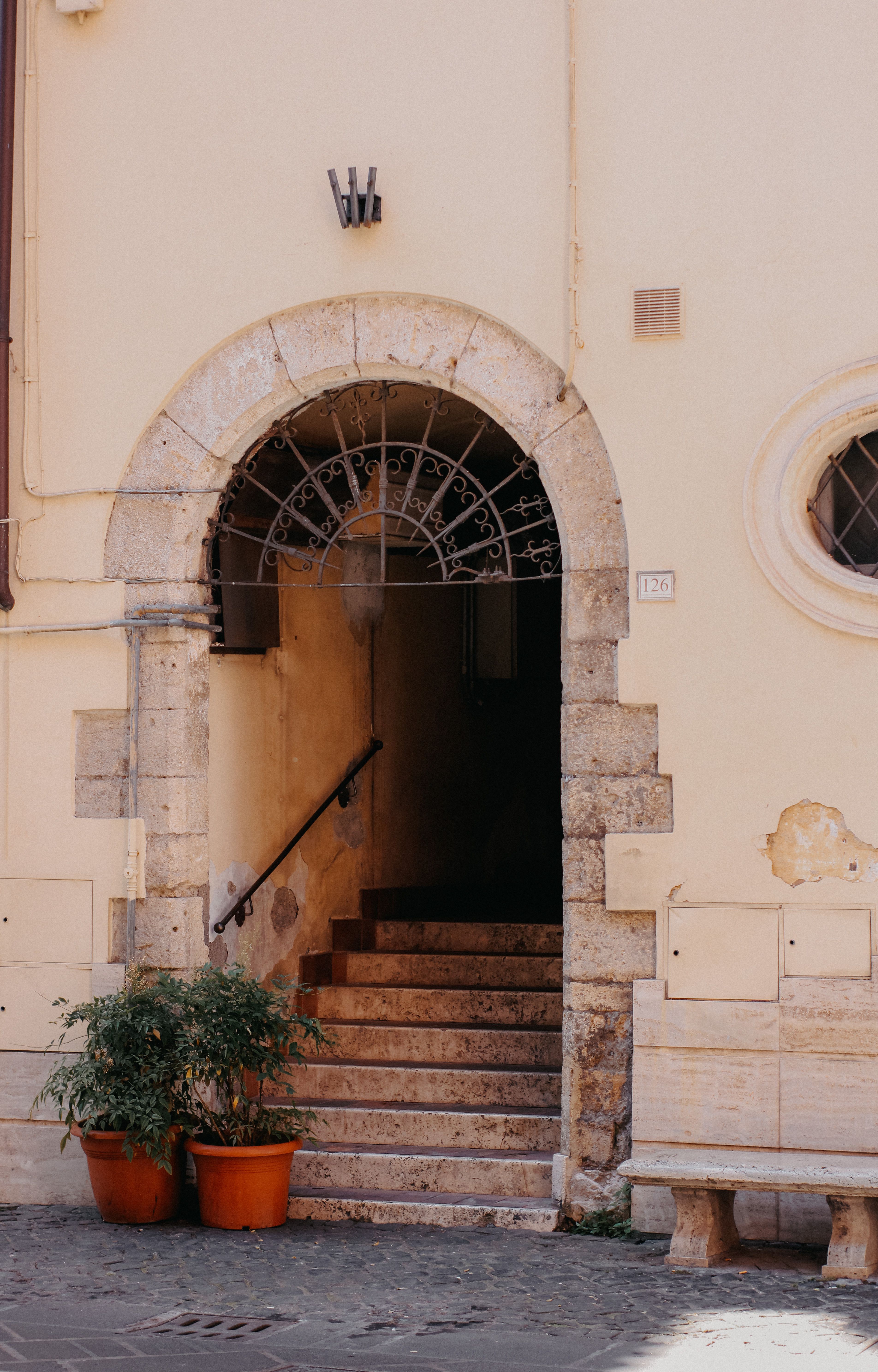 Photo of an Arch on Wall and Concrete Stairs · Free Stock Photo