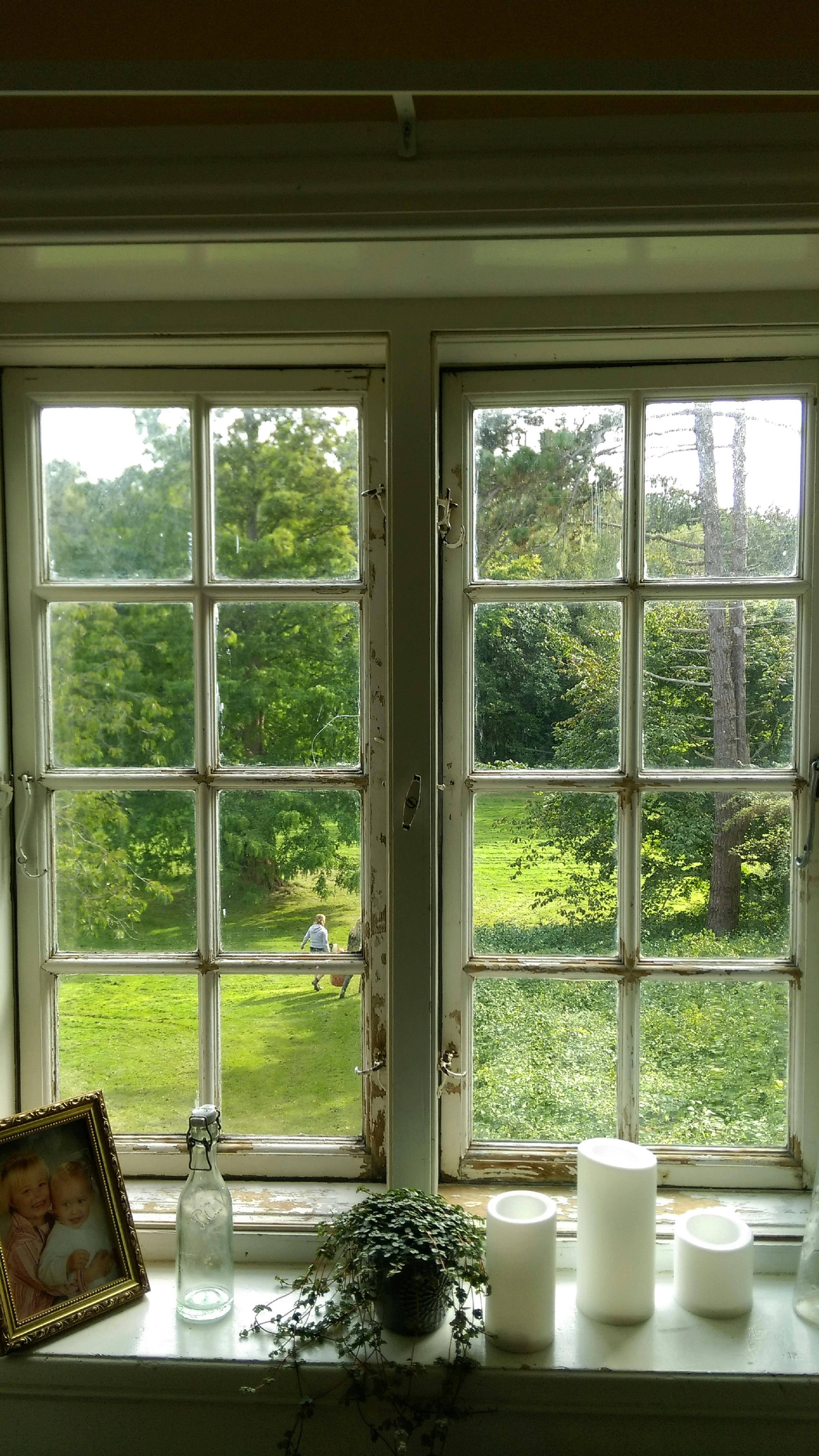 View of a Garden through a Window in an Old House · Free Stock Photo
