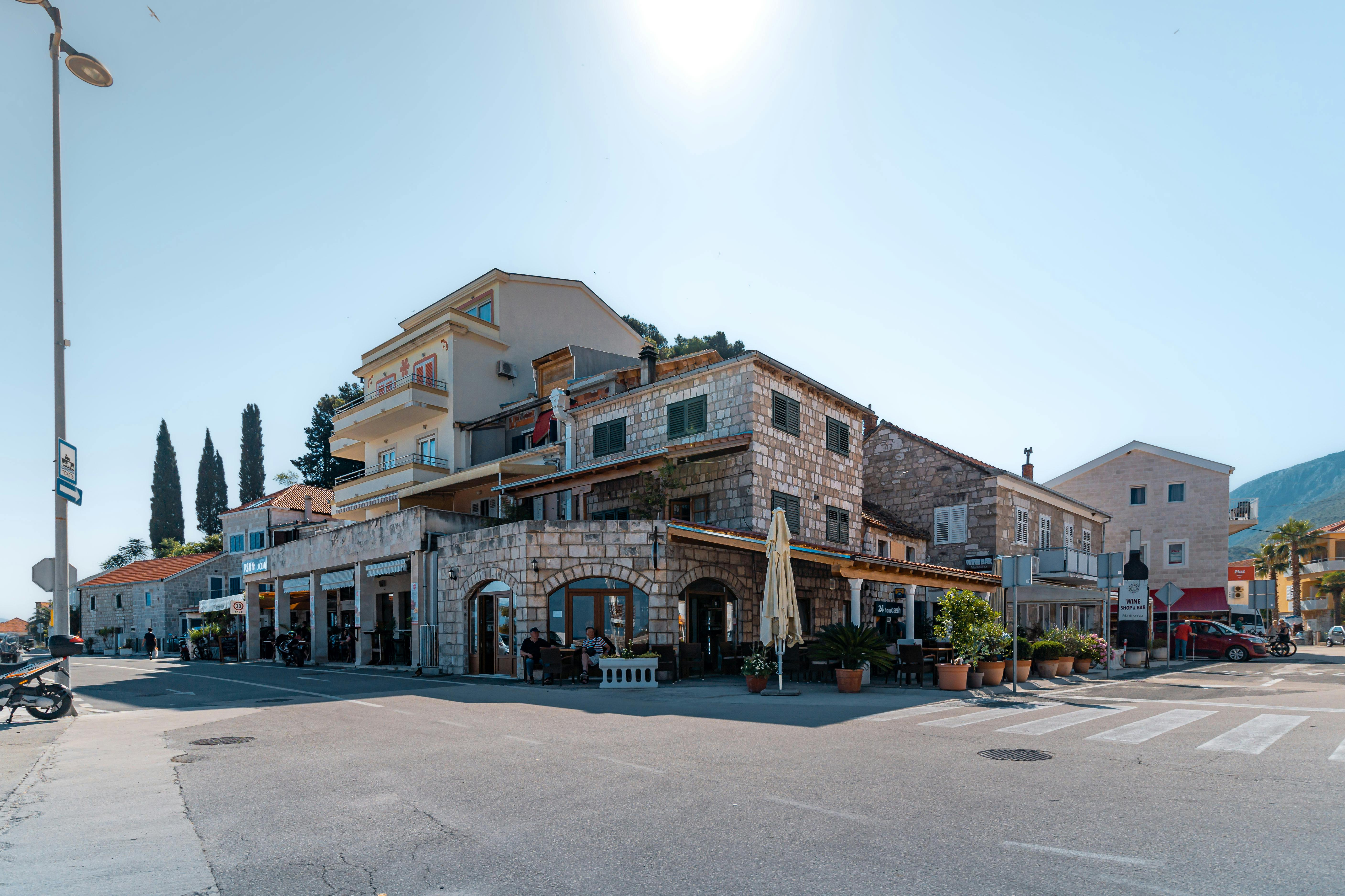 Buildings on the Corner of the Intersection · Free Stock Photo