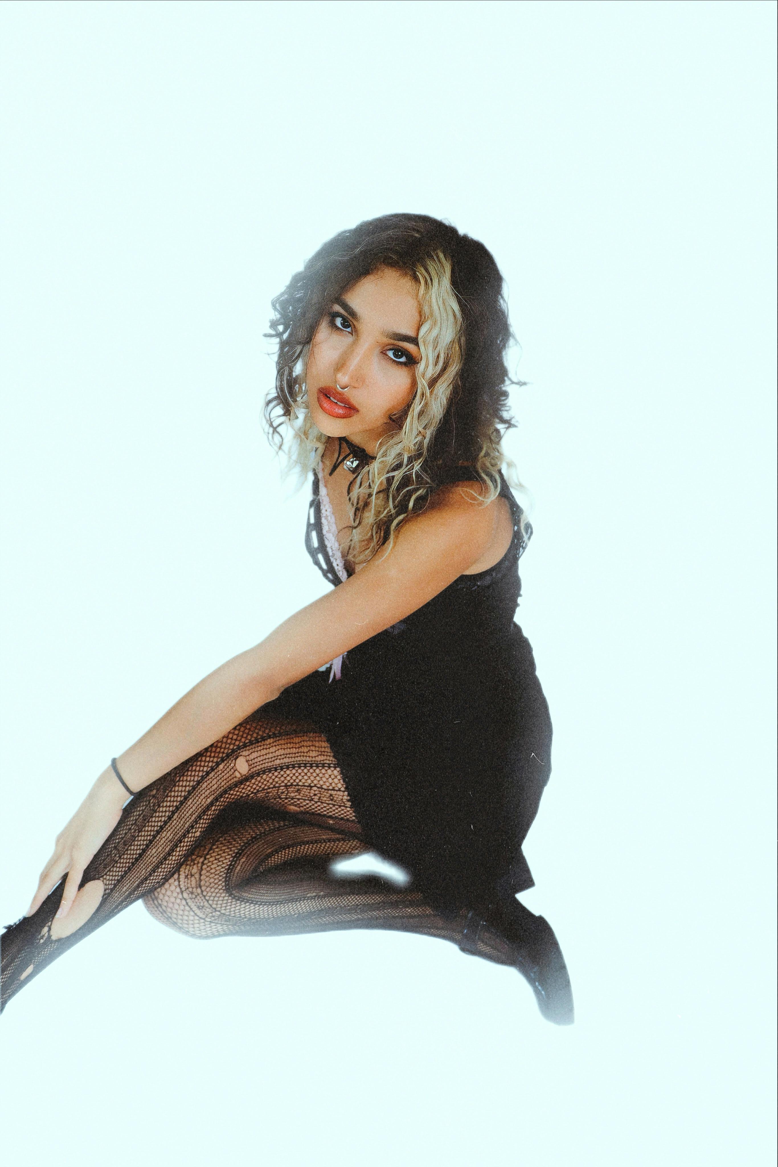 Seductive Woman in Black Bodycone Dress · Free Stock Photo