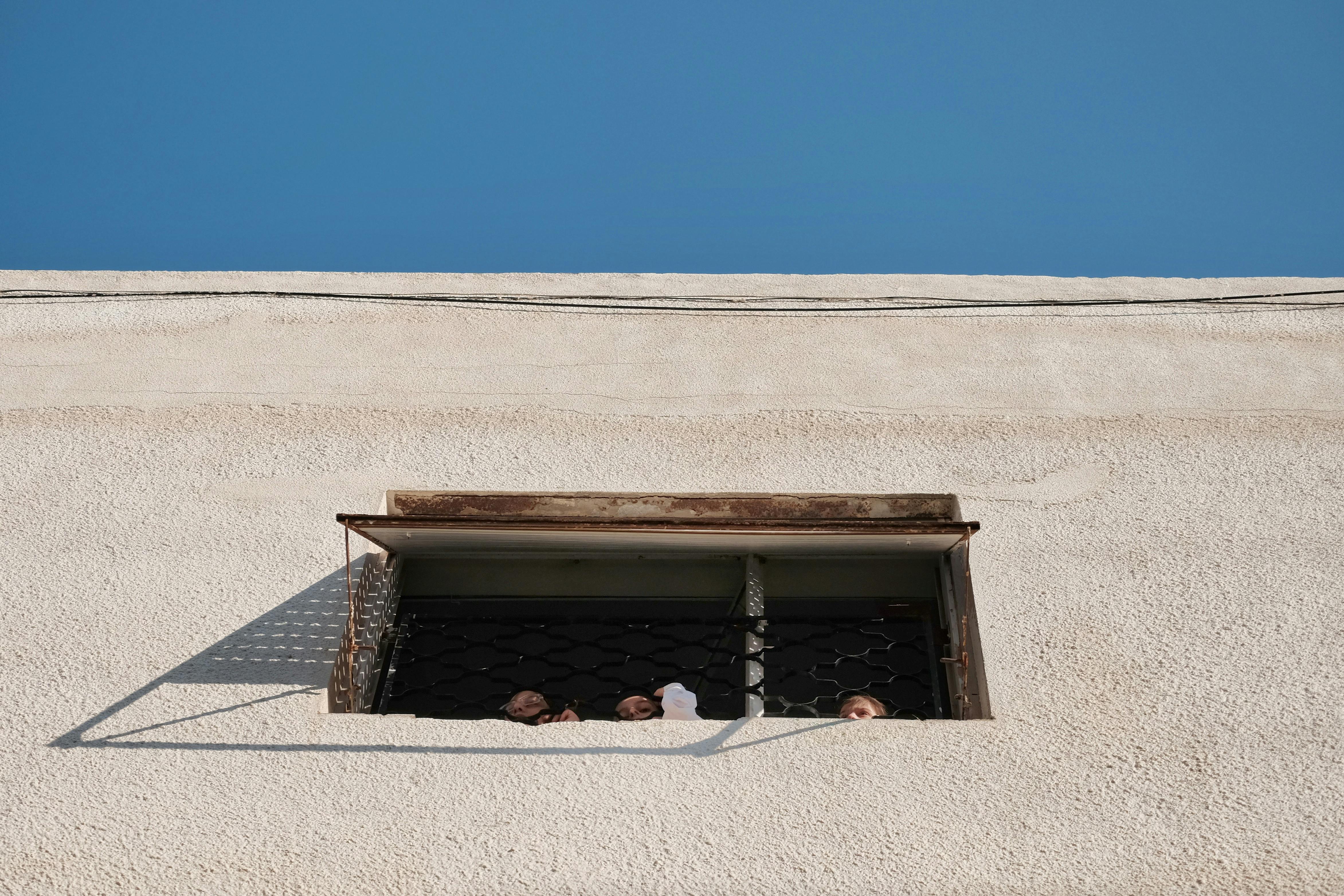Low Angle Shot of a Narrow Open Window · Free Stock Photo
