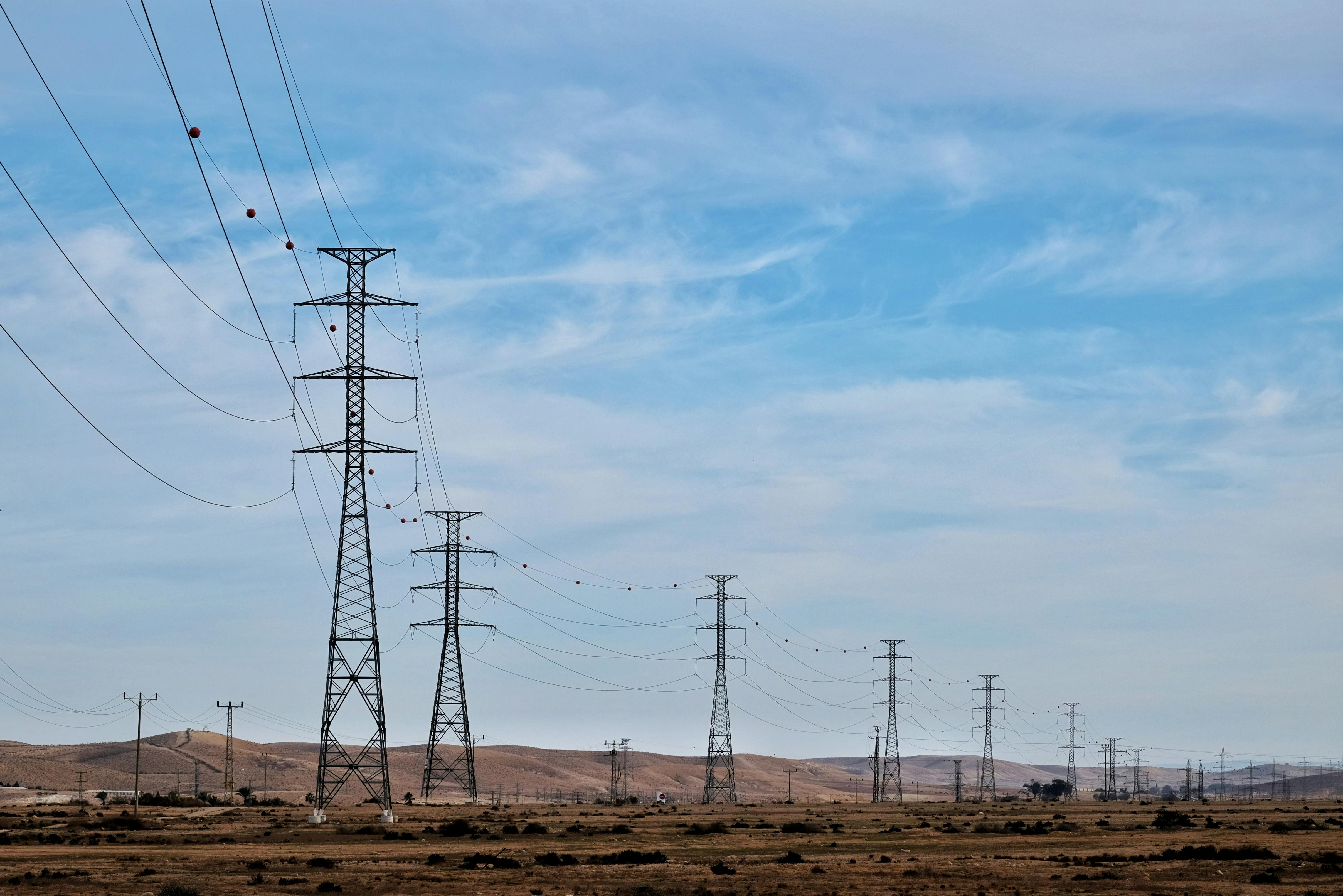 Utility Poles and Electricity Lines on a Desert · Free Stock Photo