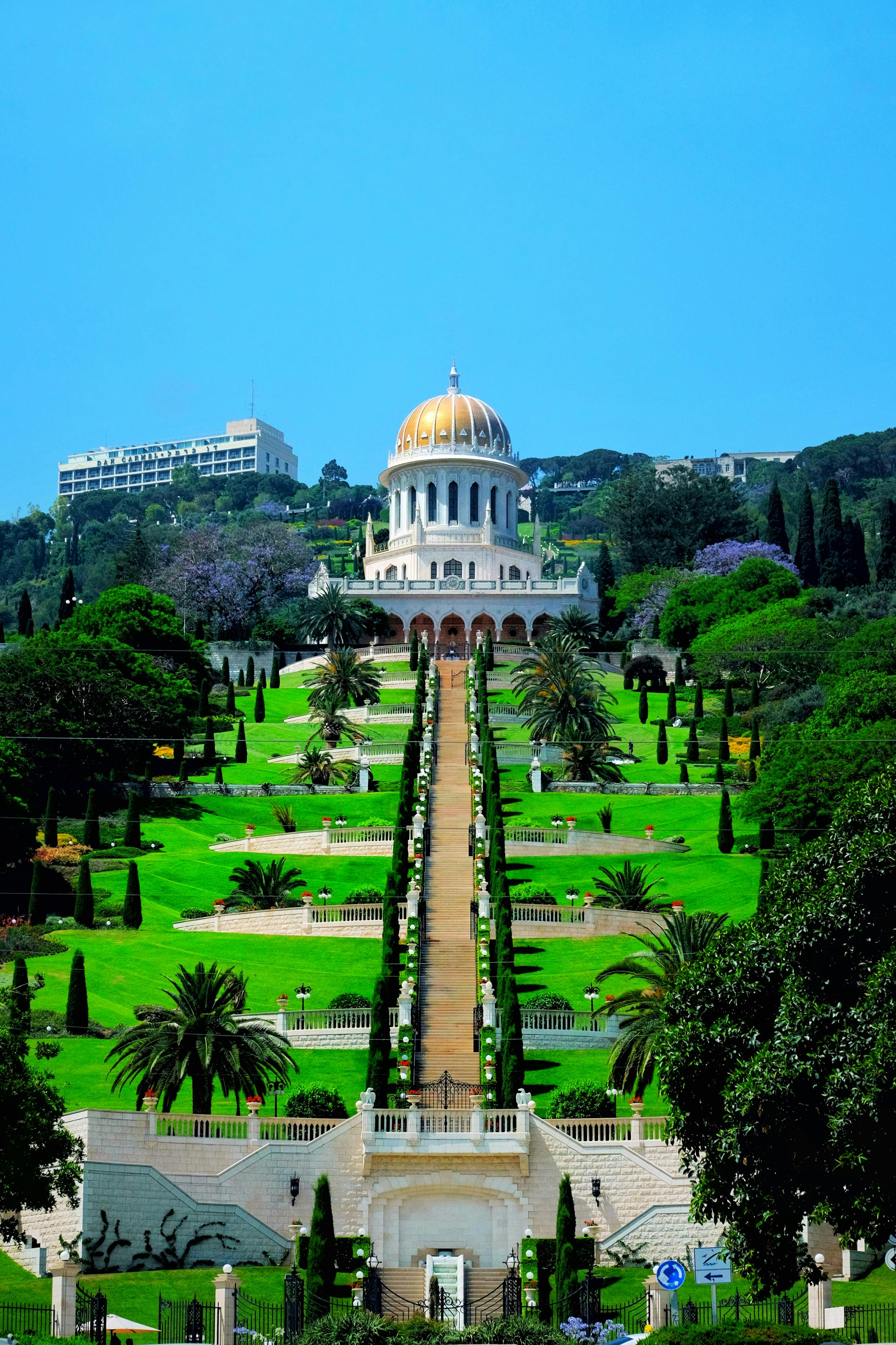 Symmetrical View of a Green Garden and a Golden Dome Monument on Top of ...