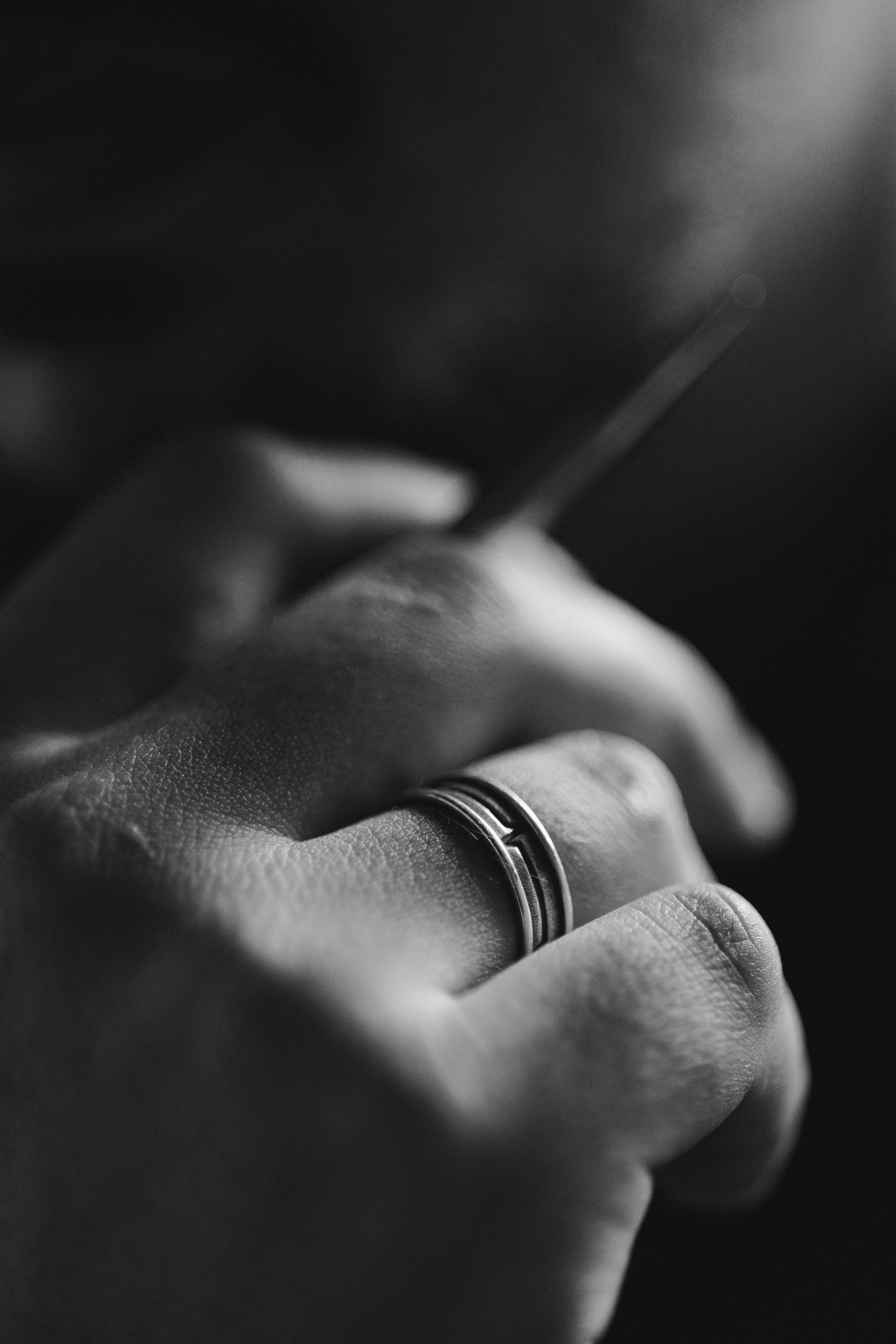 Man's Hand in Shallow Focus and Grayscale Photography · Free Stock Photo