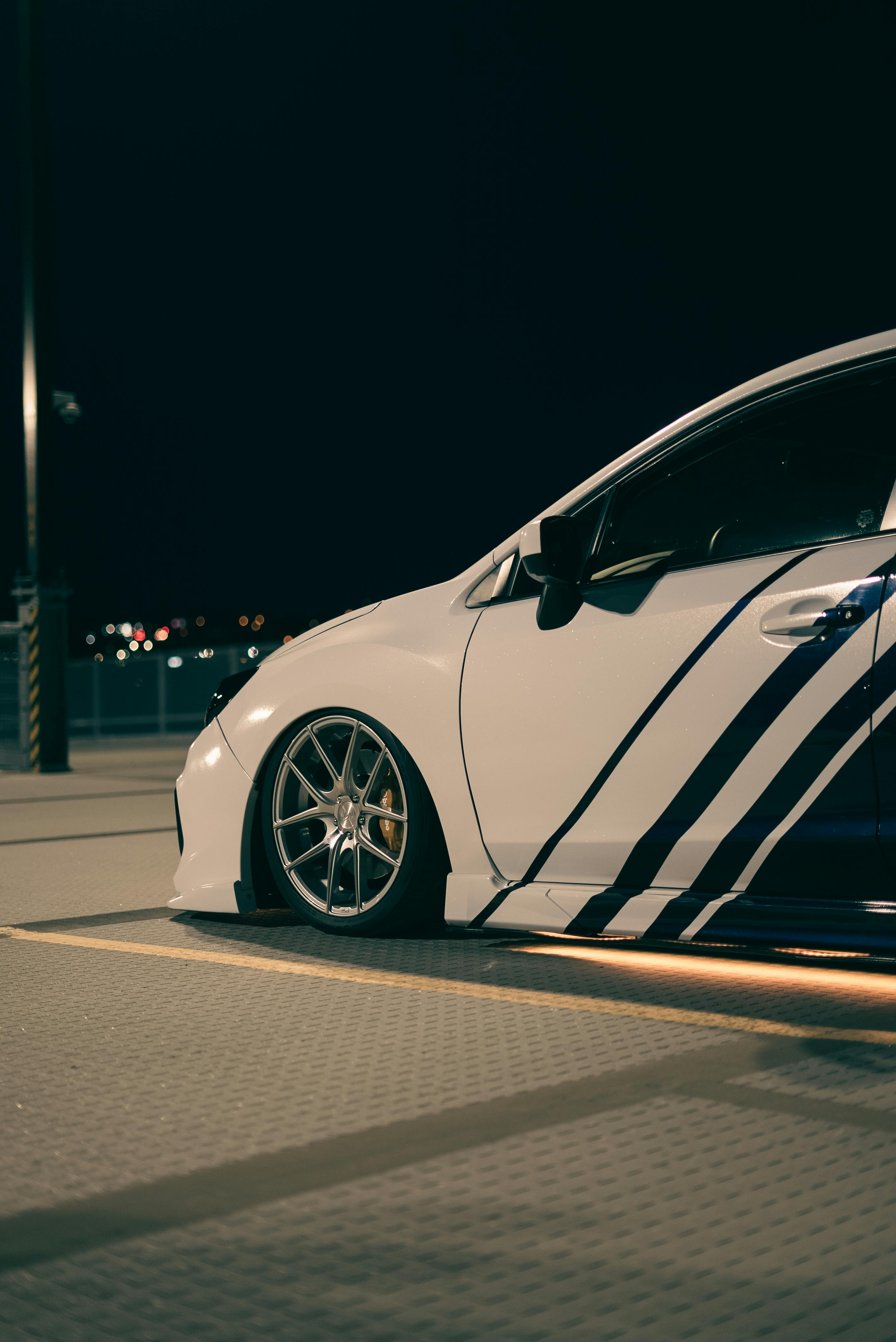 A Modified Sports Subaru on the Parking Lot at Night · Free Stock Photo