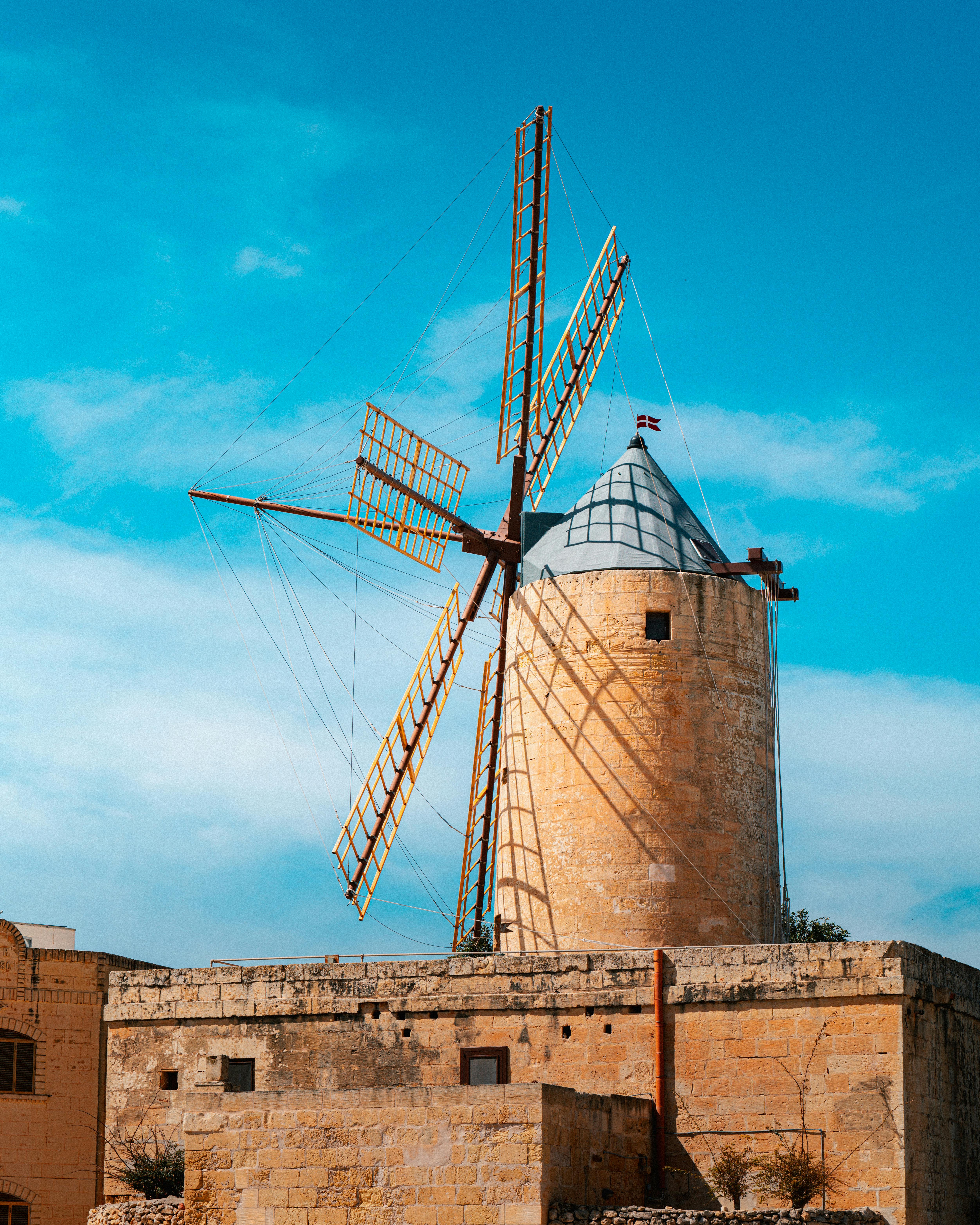 Brick Windmill against Blue Sky · Free Stock Photo