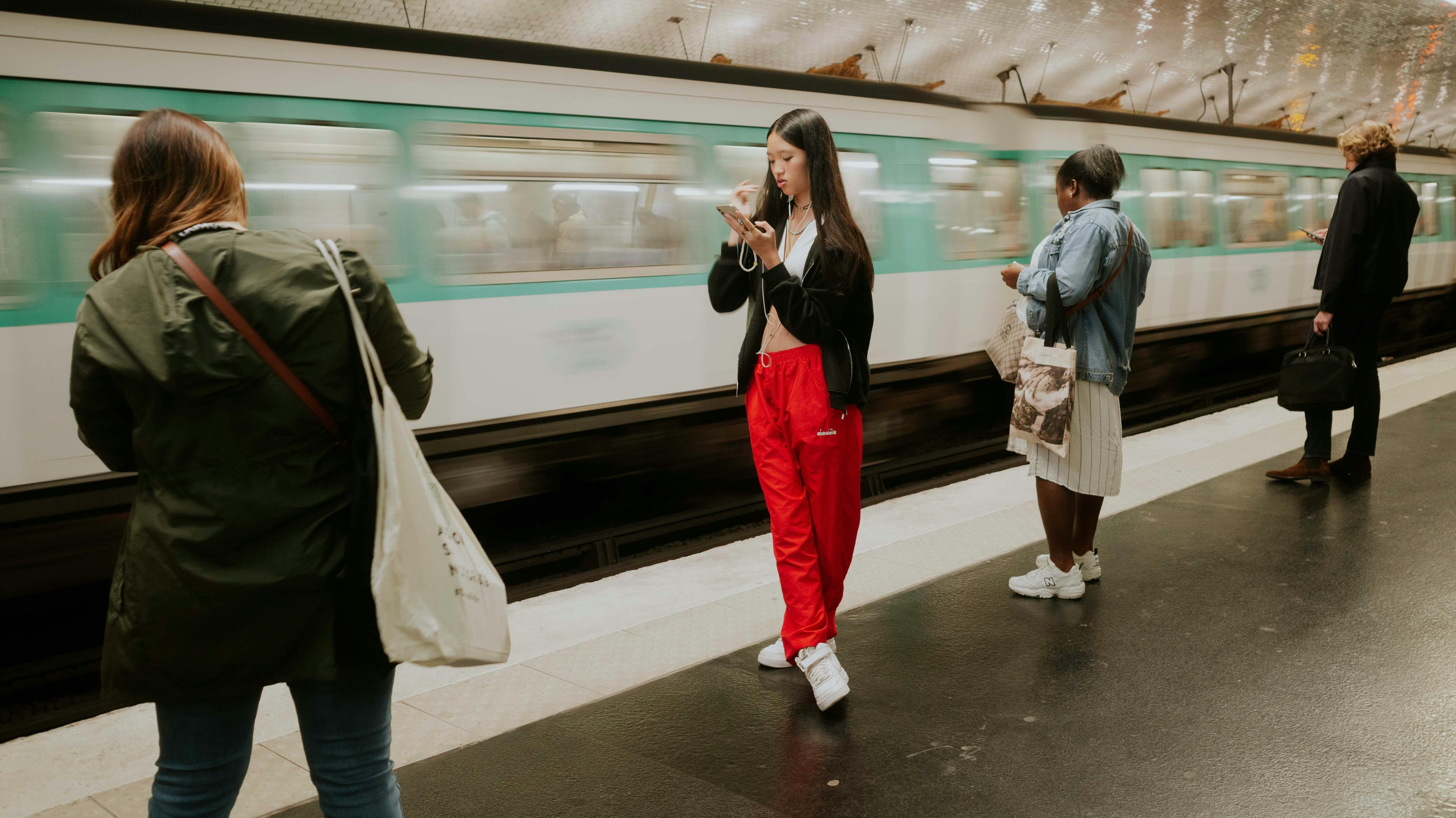 Old Asian man using smartphone while riding in subway · Free Stock Photo