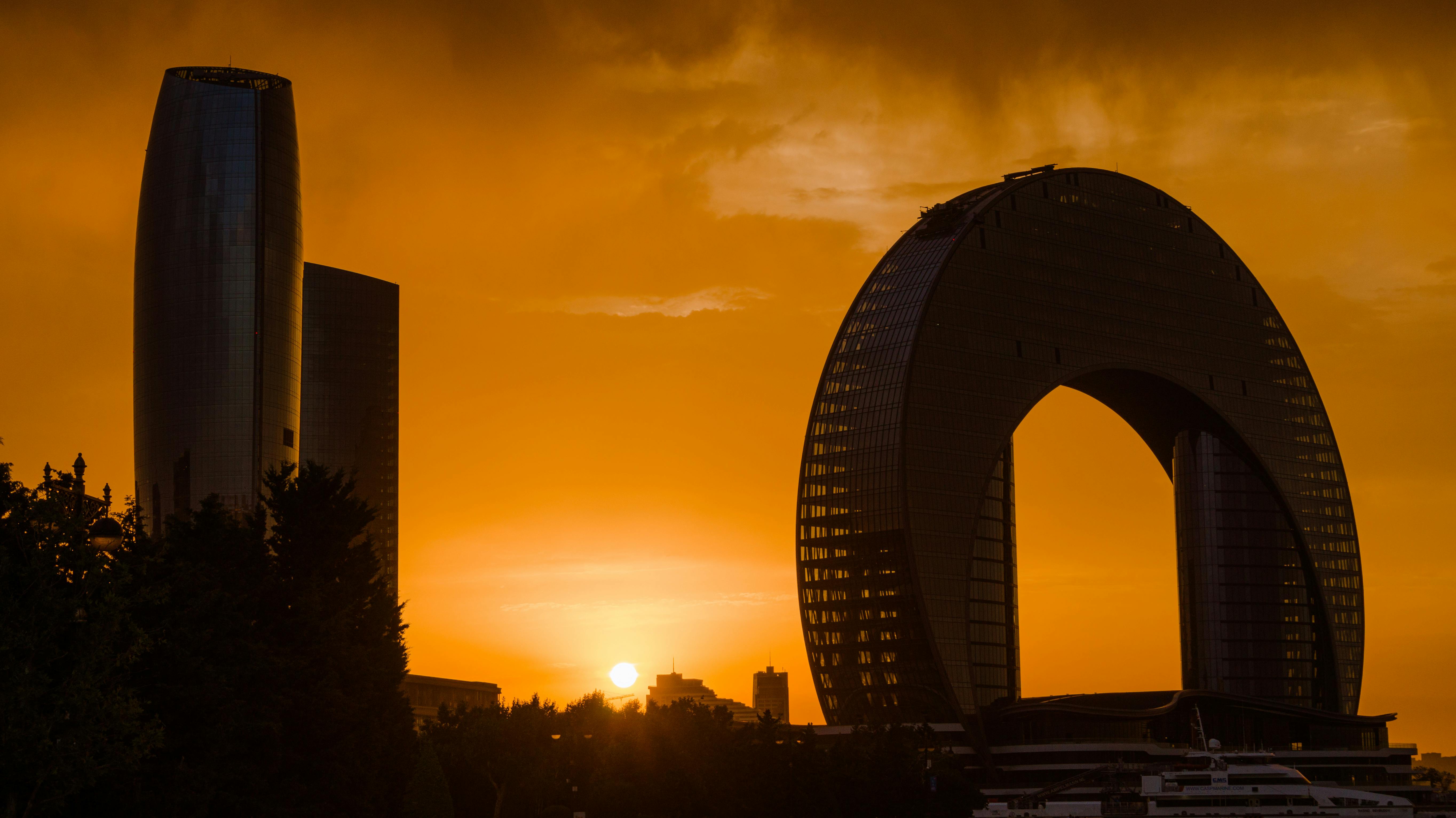 View of the Crescent Hotel and Skyscrapers at Sunset in Baku ...