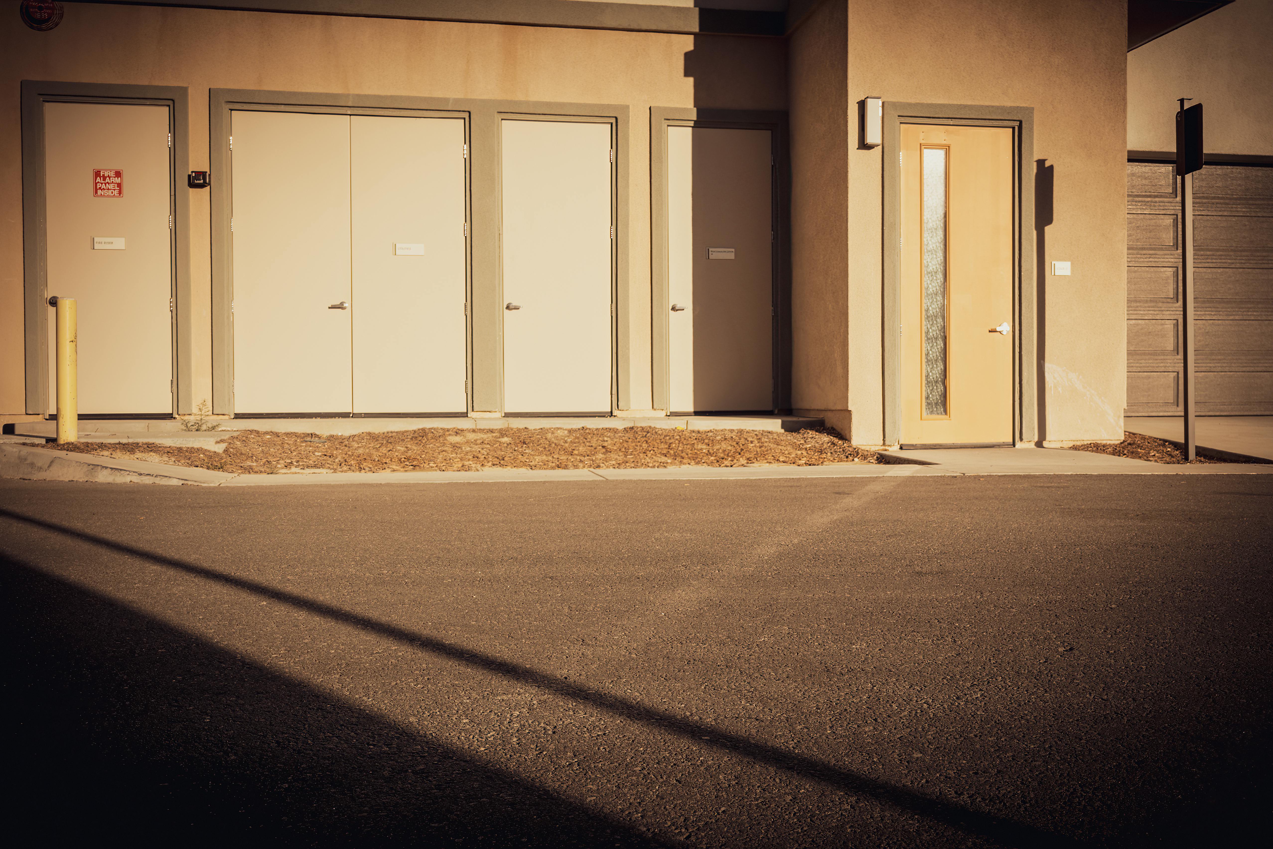 Woman Walking by Column near Street · Free Stock Photo