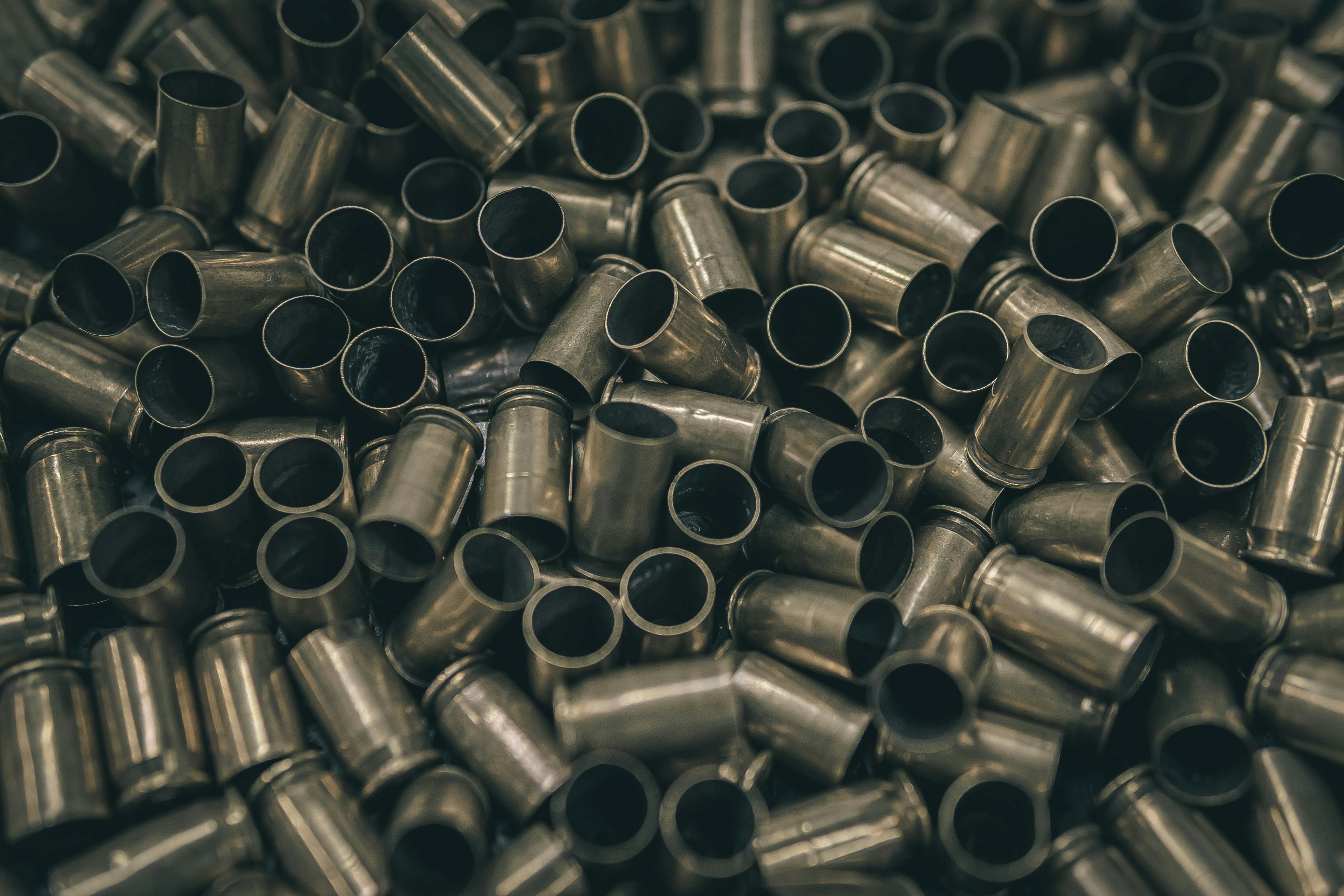 Bullet Collection on White Surface · Free Stock Photo